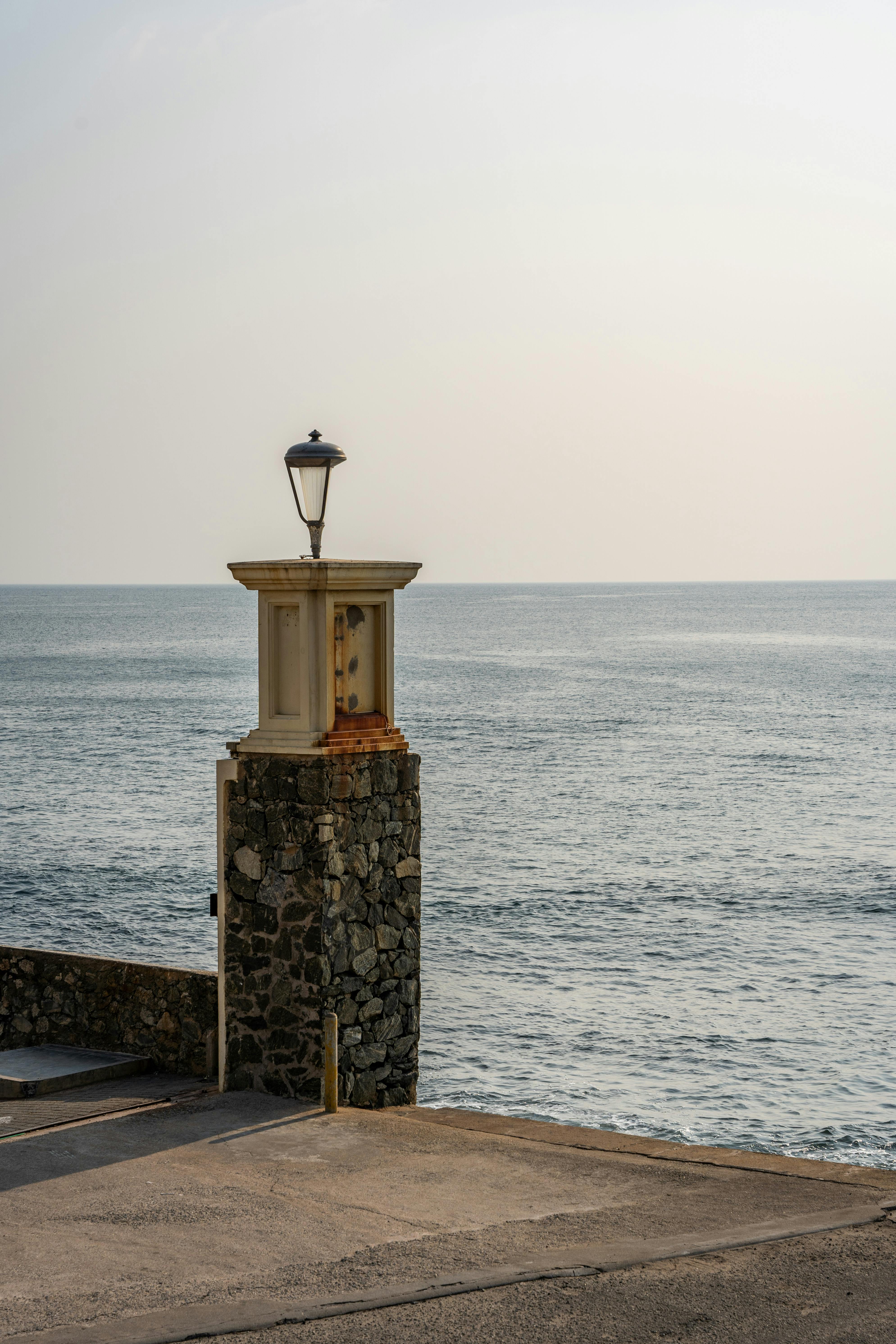 Seaside Lamp Post Overlooking Colombo's Ocean · Free Stock Photo