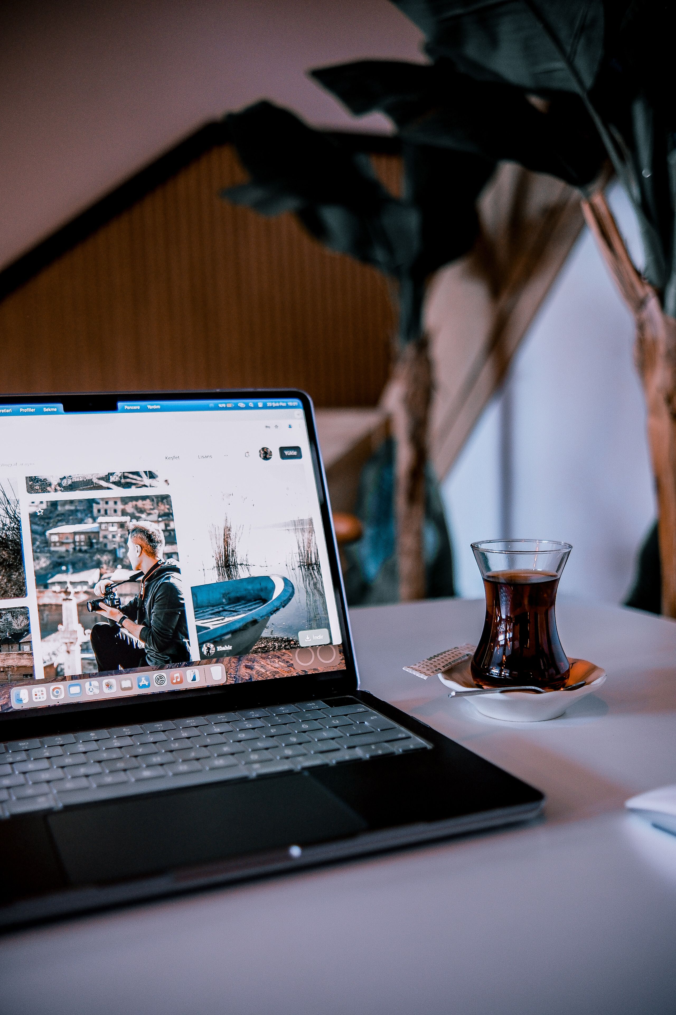 Laptop on Table with Tea Glass Indoors · Free Stock Photo