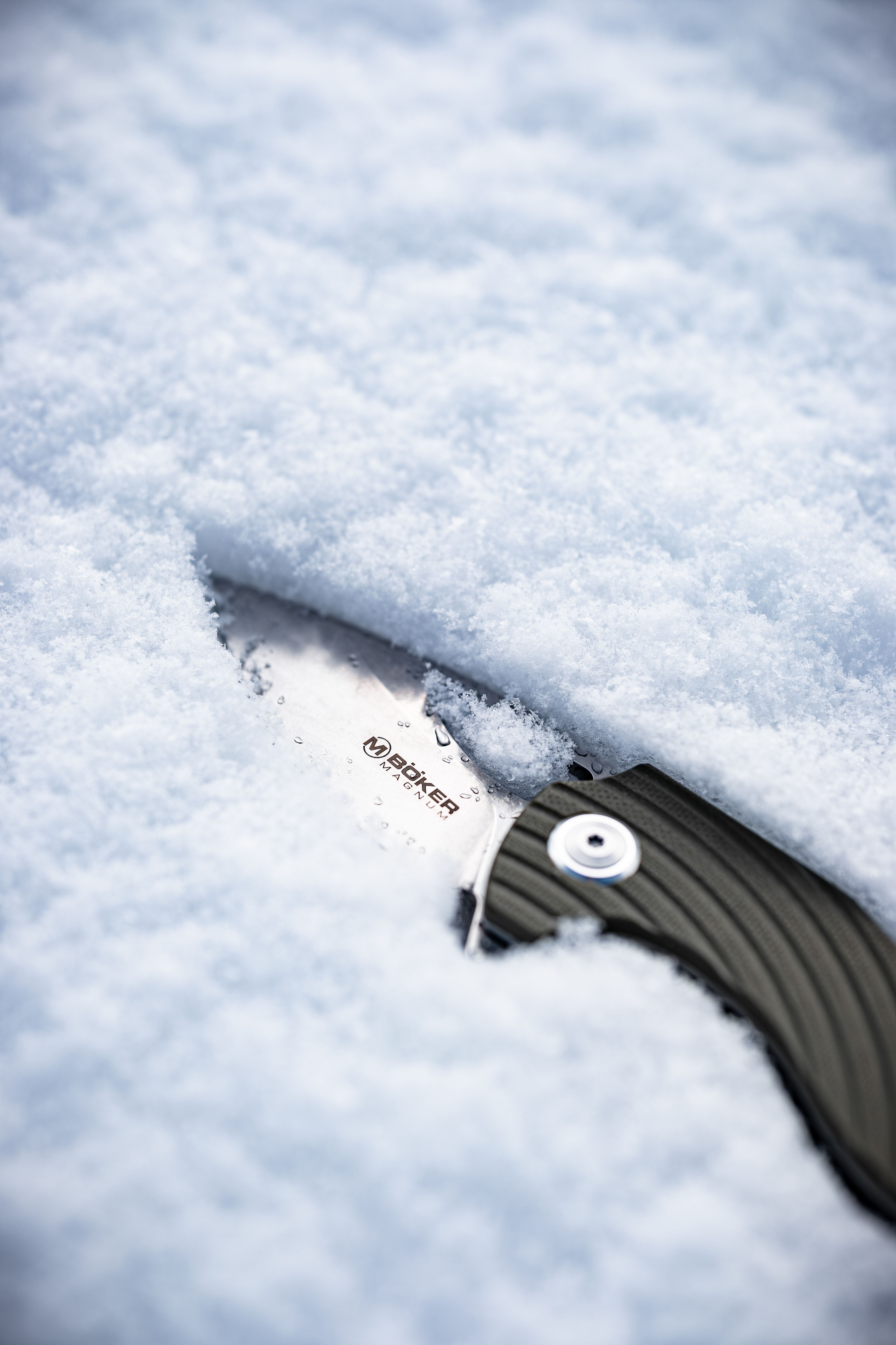 Knife Partially Buried in Snow · Free Stock Photo
