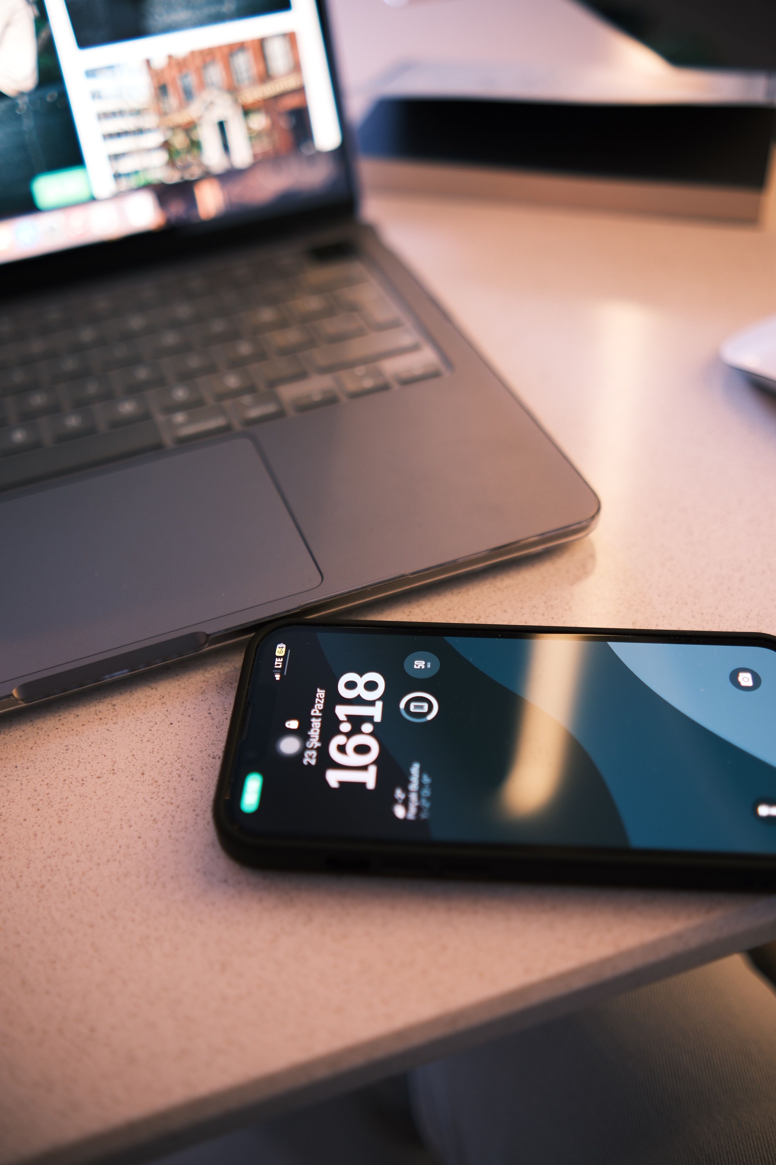 Modern Workspace with Laptop and Smartphone · Free Stock Photo