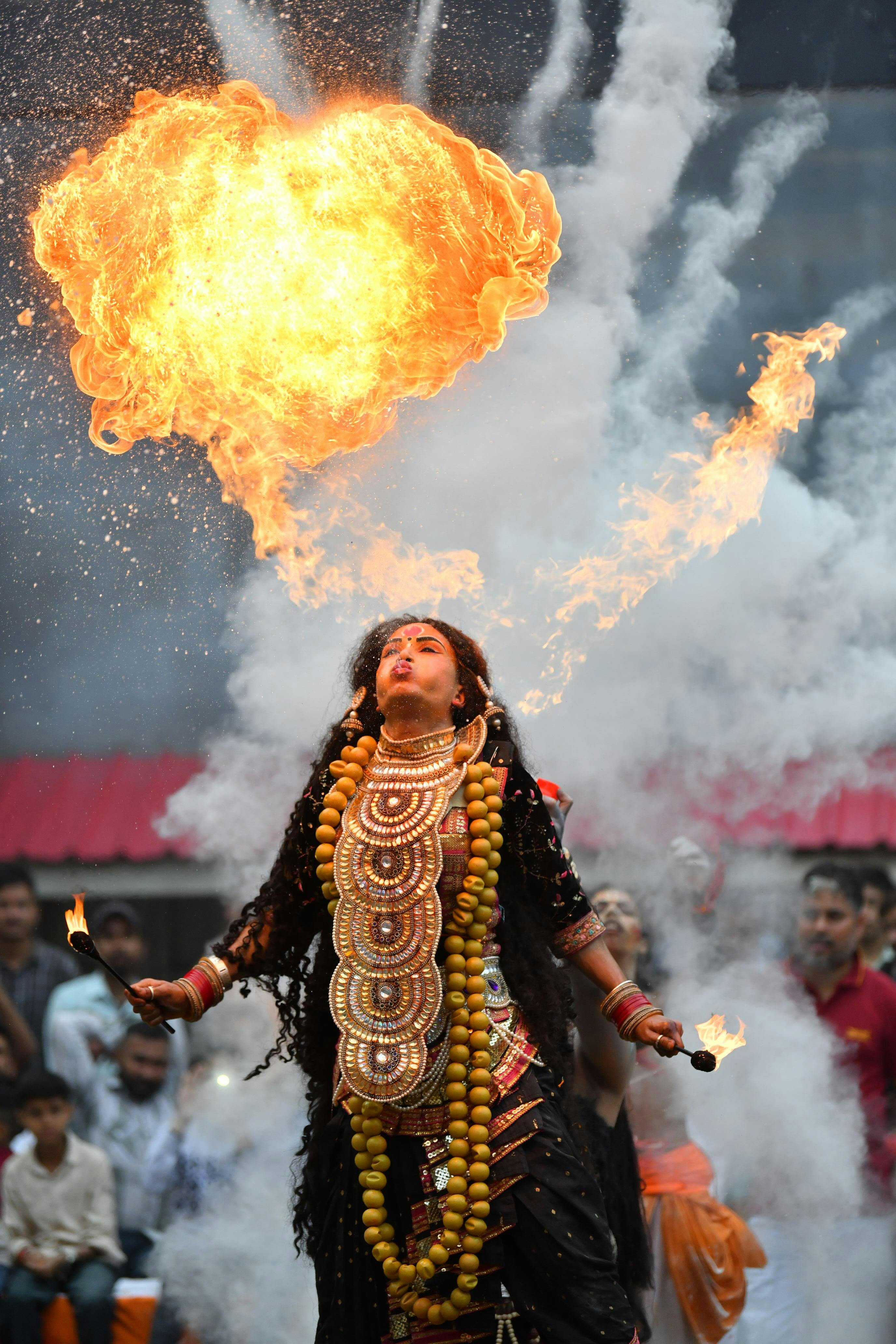 Fire Breather Performing Traditional Ritual Outdoors · Free Stock Photo