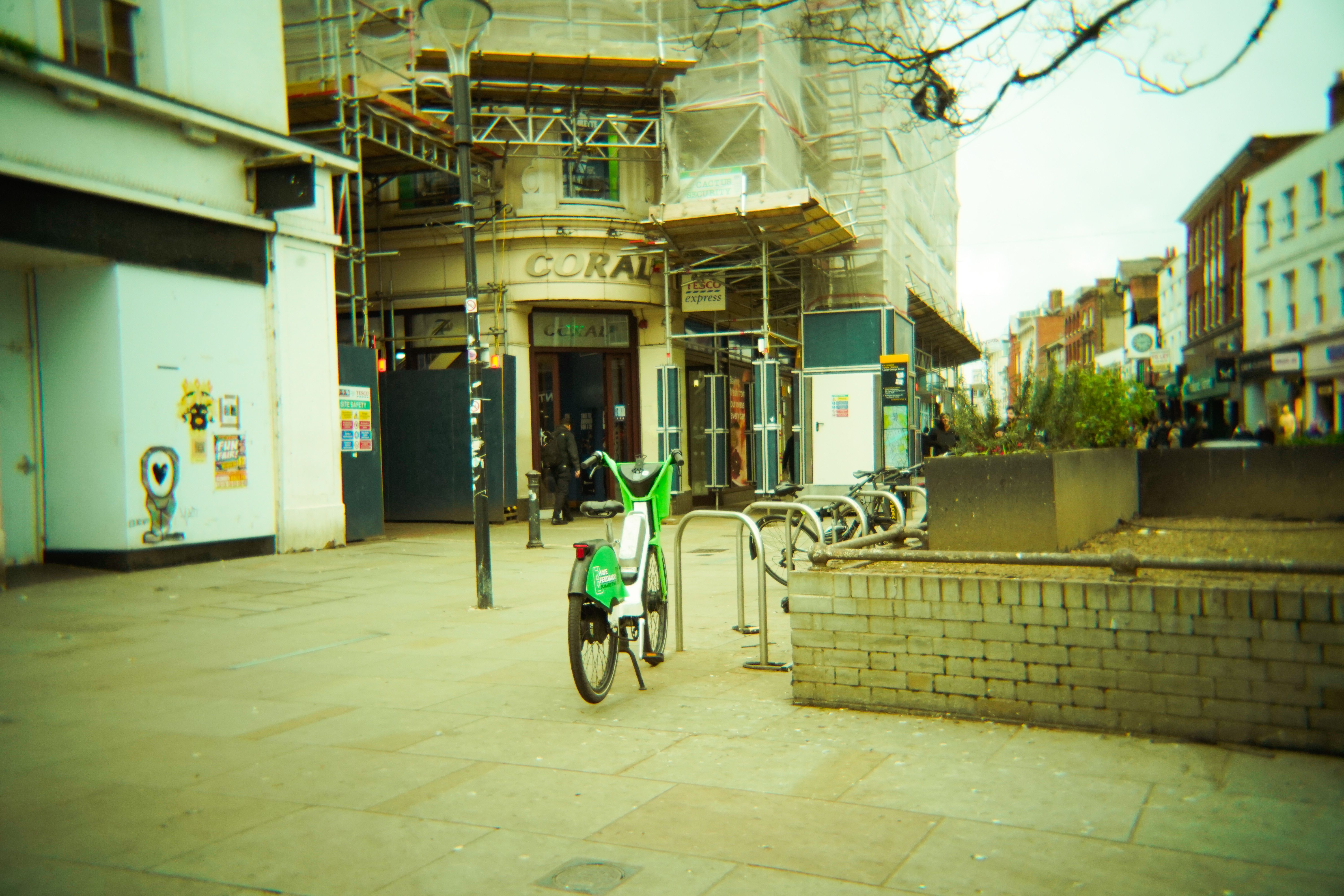 Urban Street Scene with Bicycle Parking · Free Stock Photo