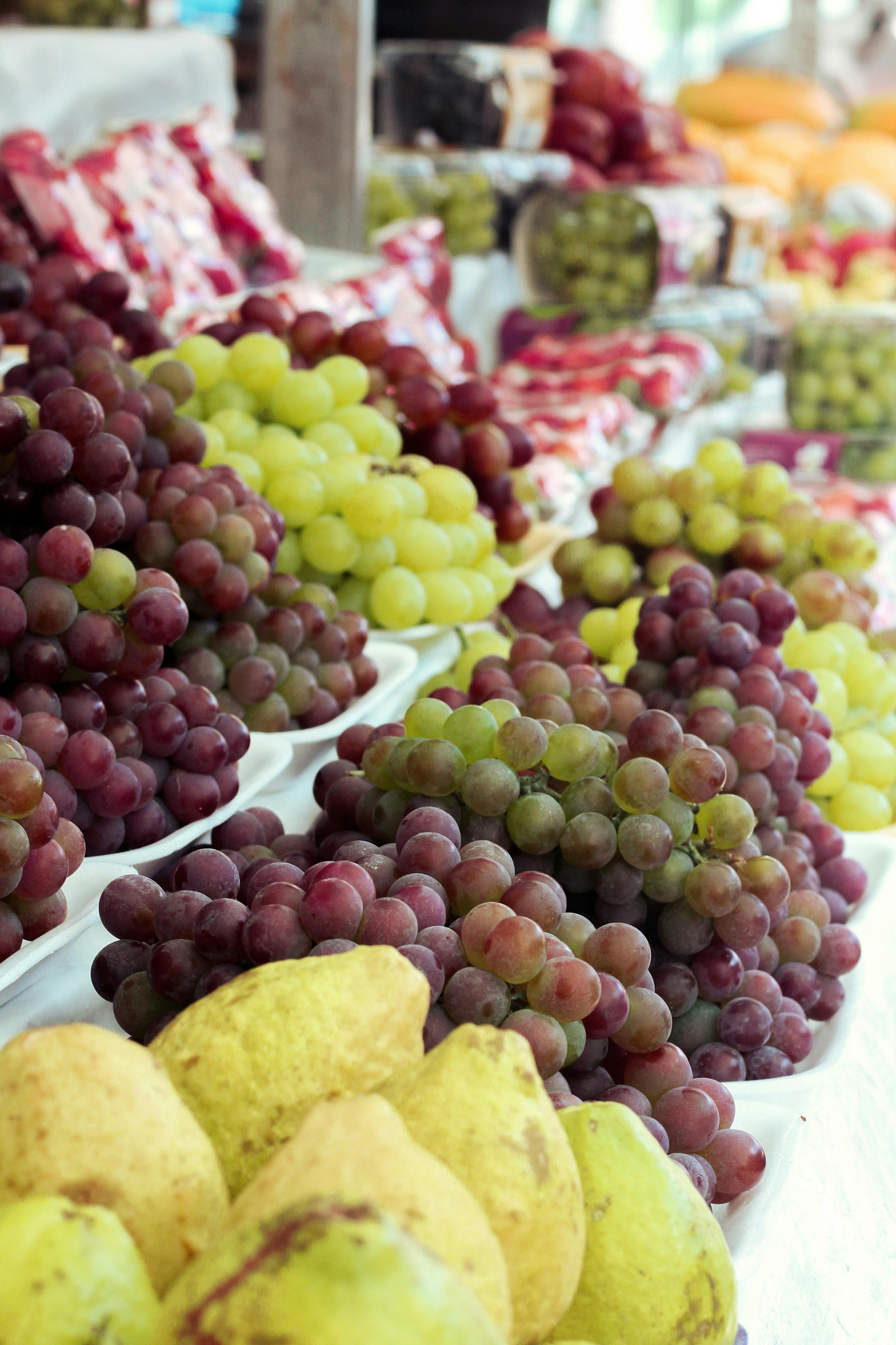 Fresh Fruit Market Display with Grapes · Free Stock Photo