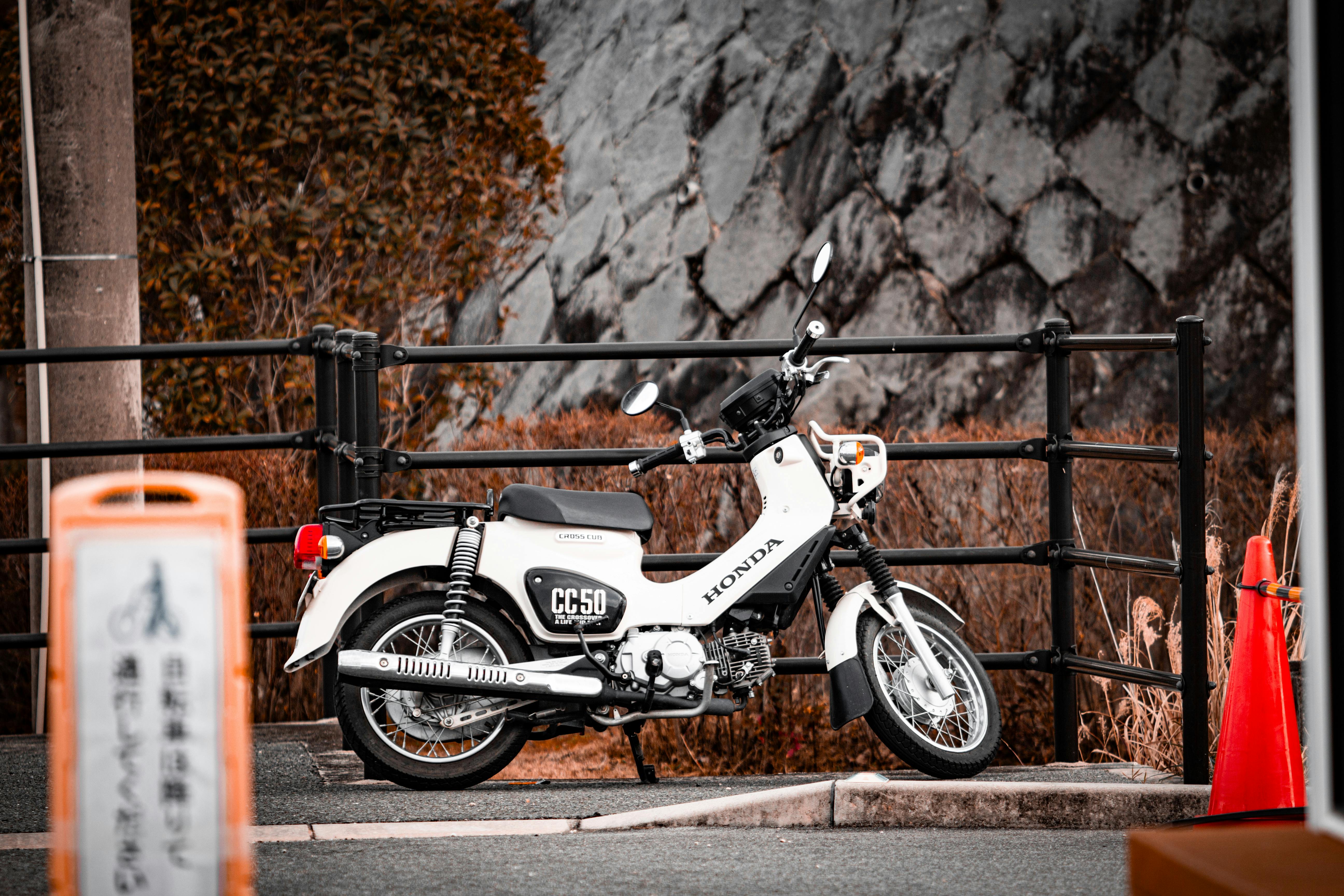 Classic White Honda Motorcycle Parked Outdoors · Free Stock Photo