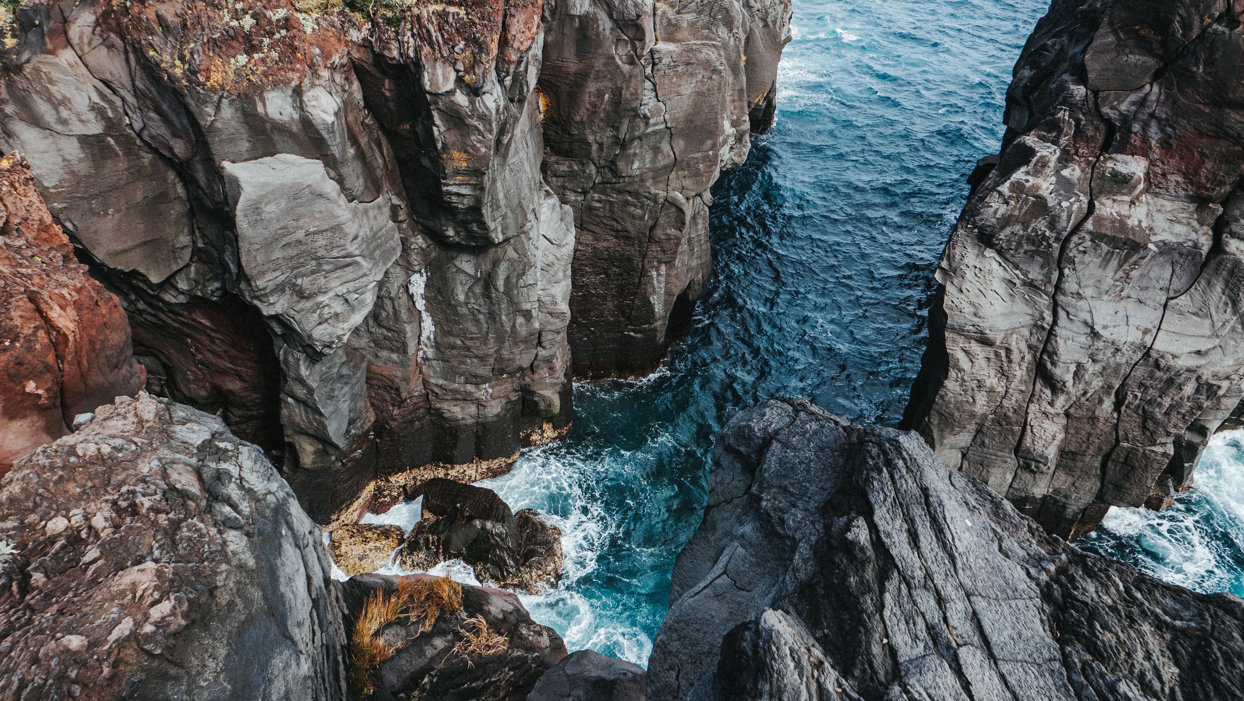 Dramatic Coastal Cliffs Overlooking Turquoise Sea · Free Stock Photo
