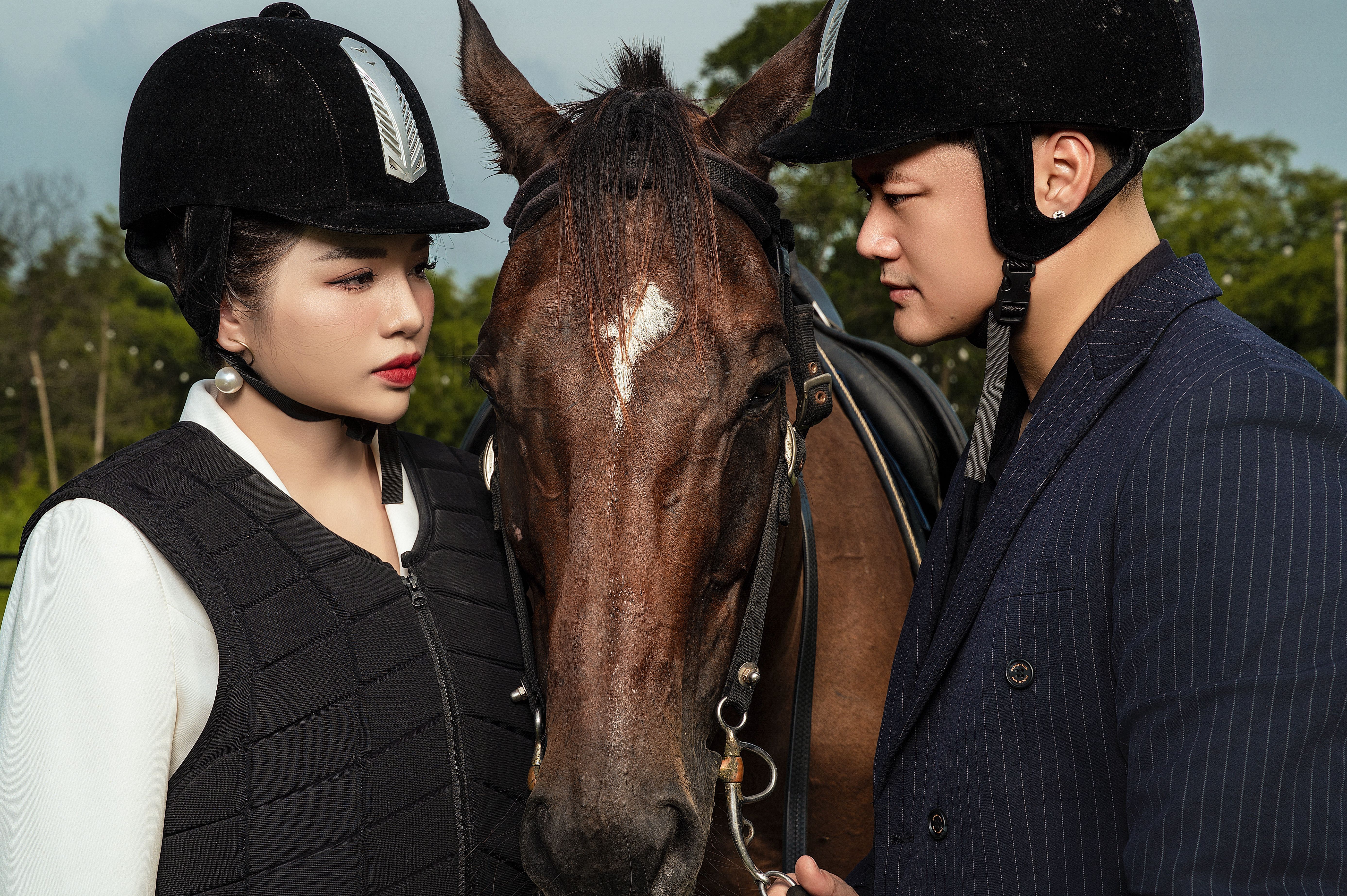 Equestrian Couple with Horse in Outdoor Setting · Free Stock Photo
