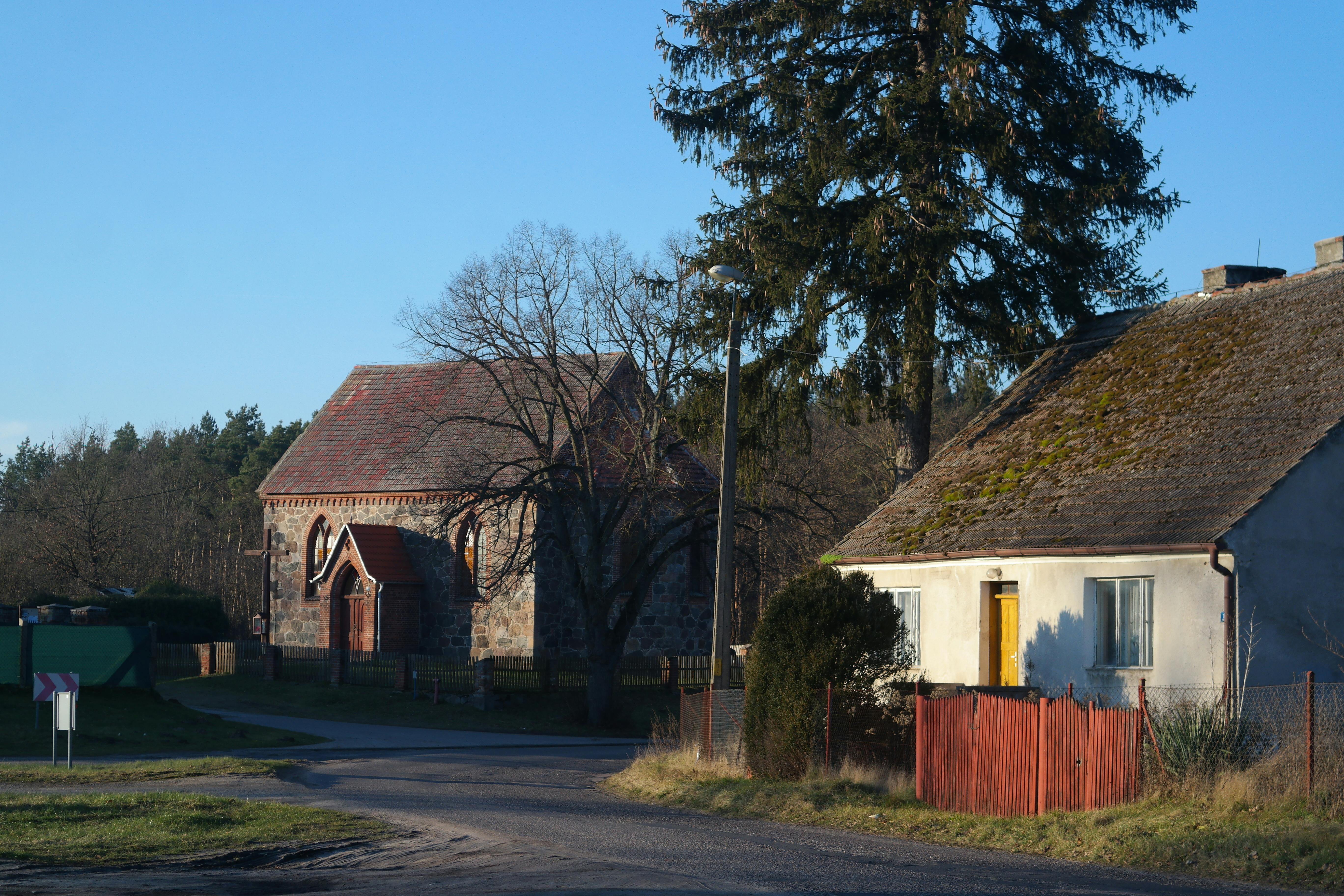 Historic Rural Village with Stone Church · Free Stock Photo
