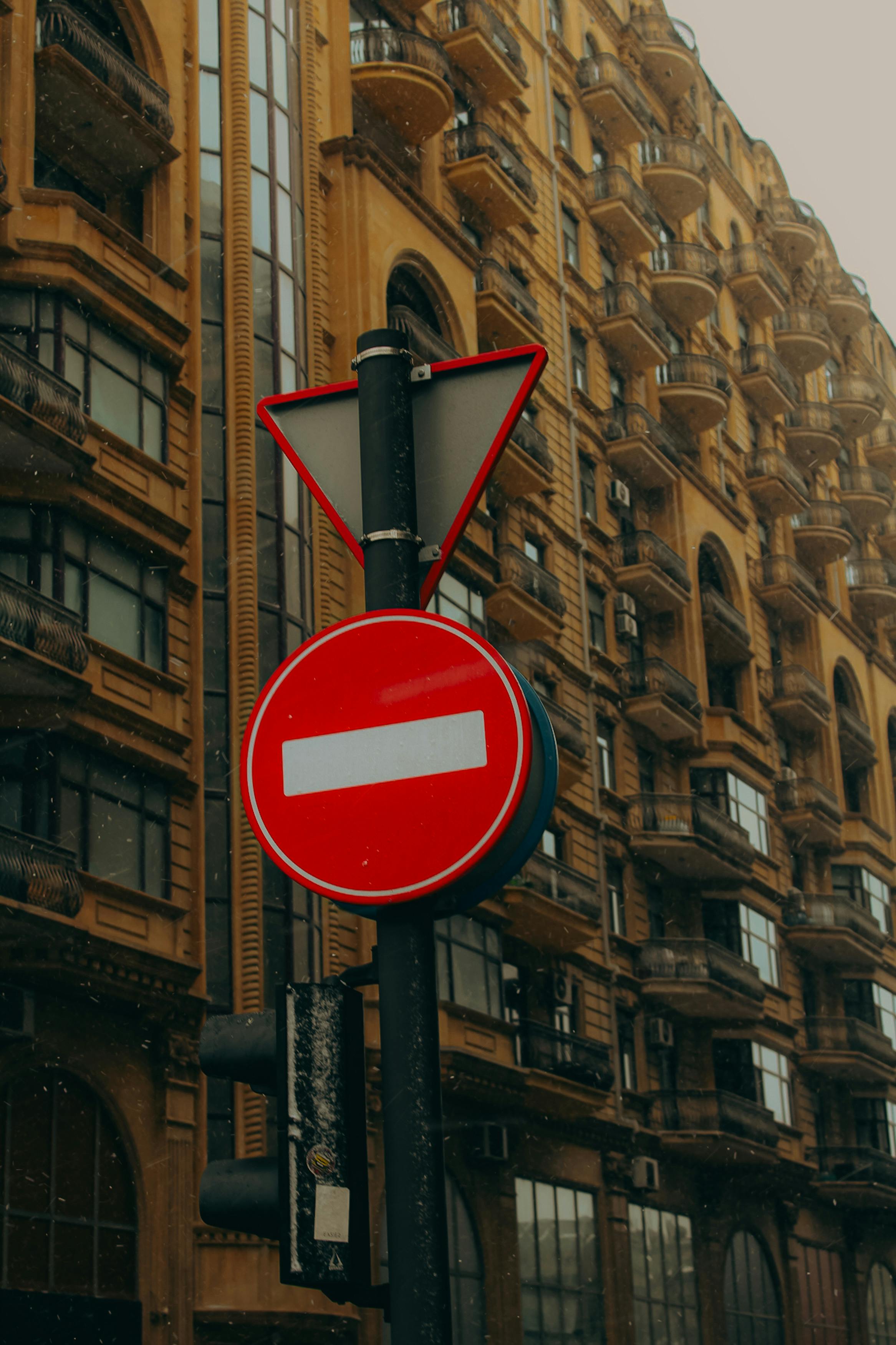 Urban Scene with No Entry Sign and Apartment Building · Free Stock Photo