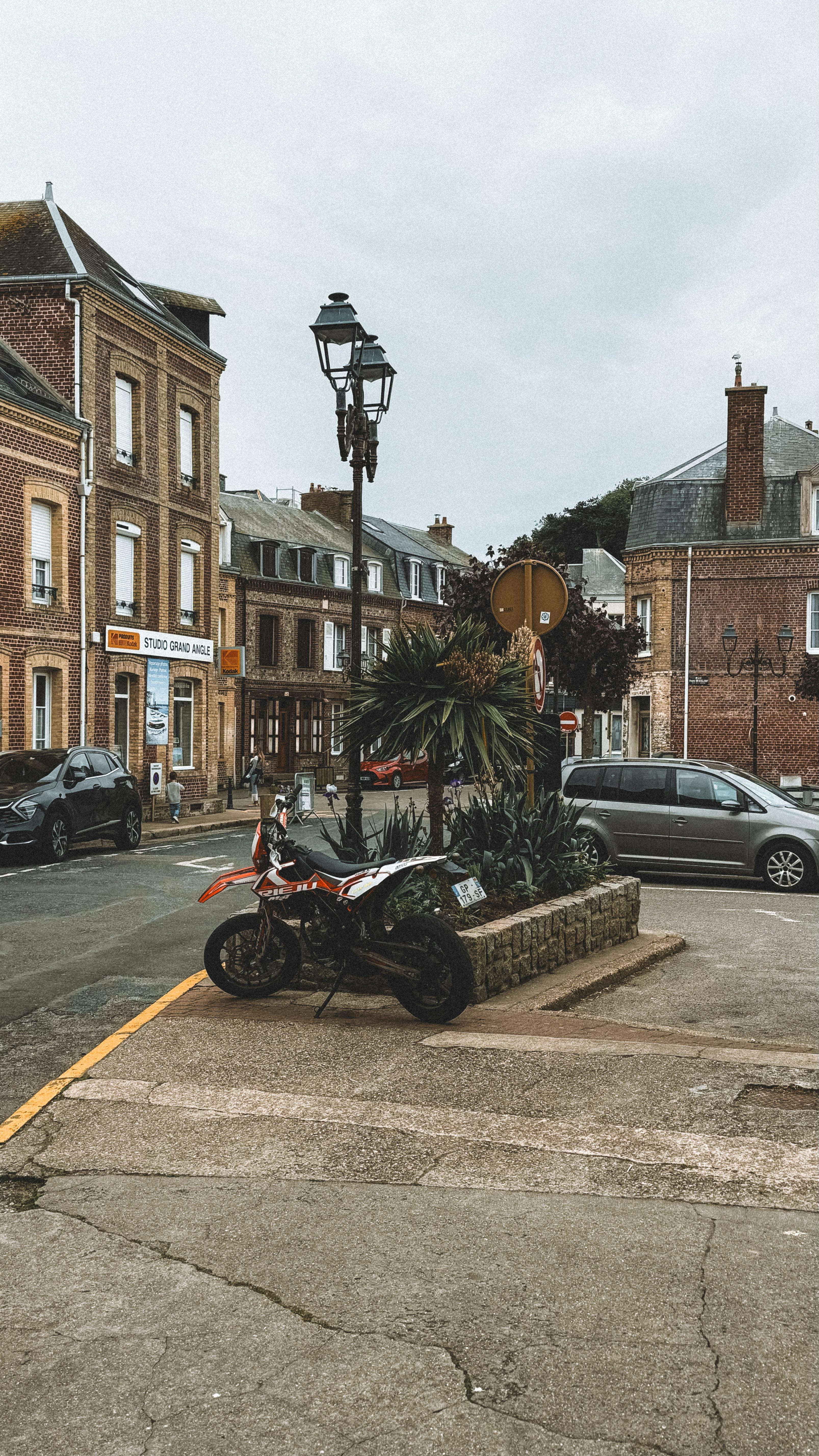Charming European Street with Motorcycle Scene · Free Stock Photo