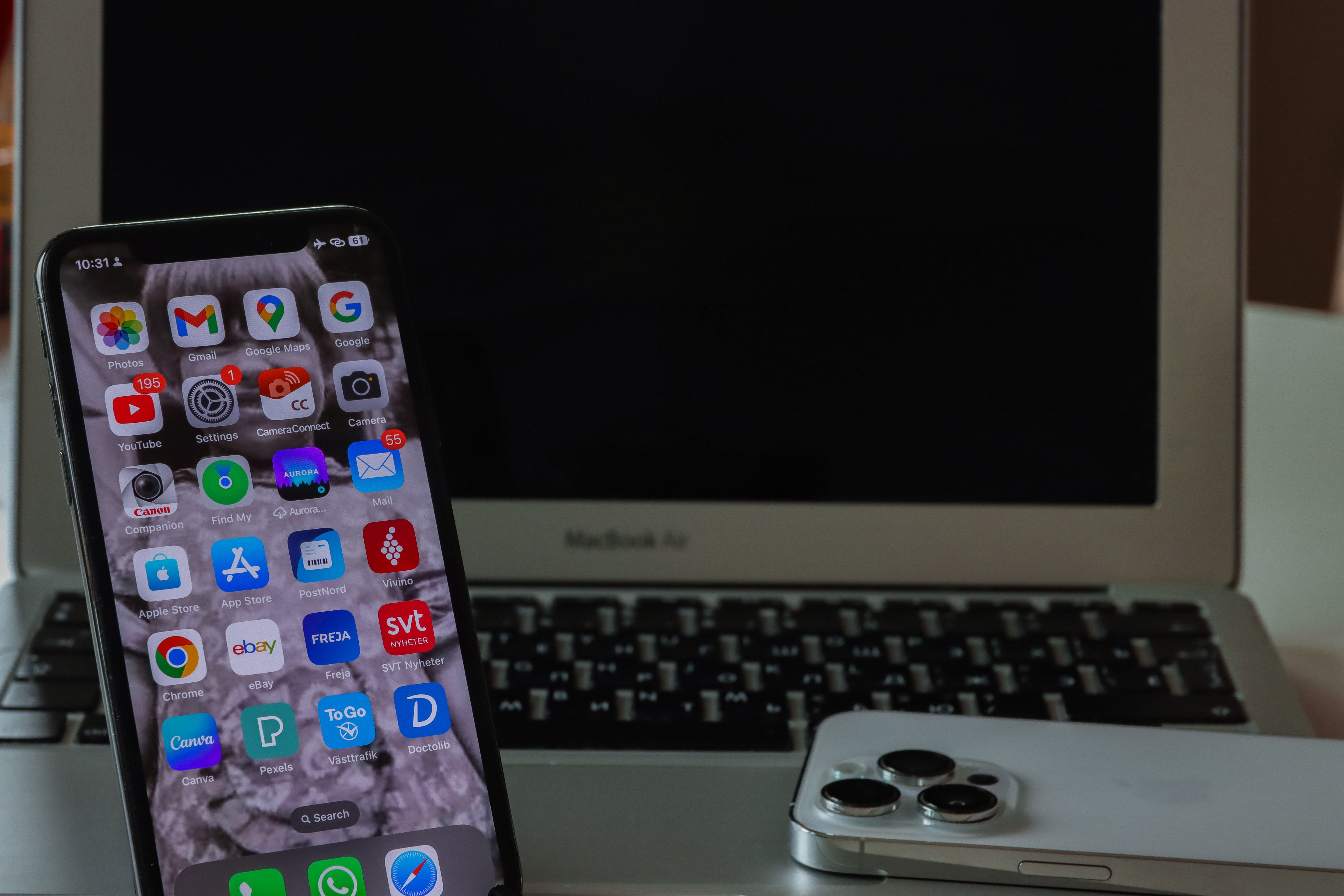 Smartphone and Laptop on Desk Setup · Free Stock Photo