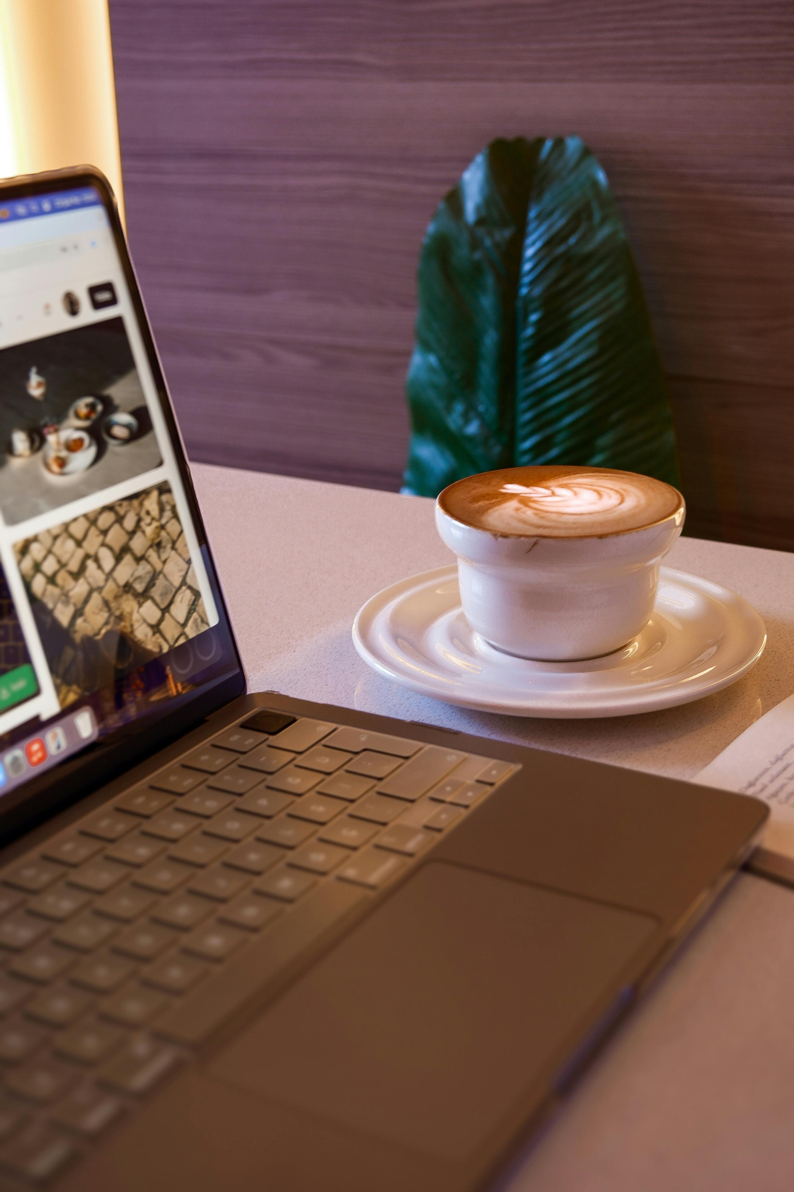 Modern Workspace with Laptop and Coffee Cup · Free Stock Photo