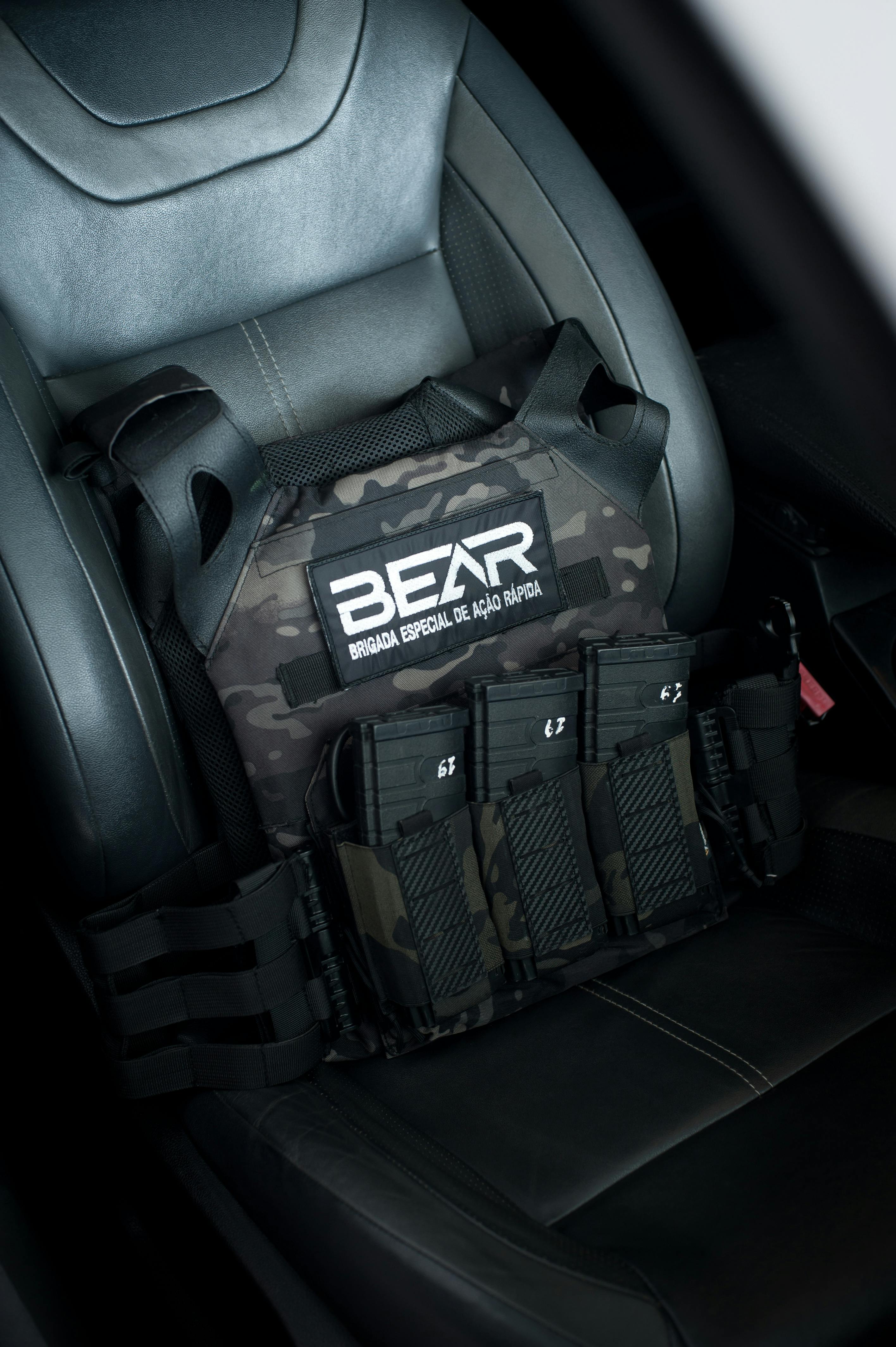 Tactical Vest with Magazines on Car Seat · Free Stock Photo