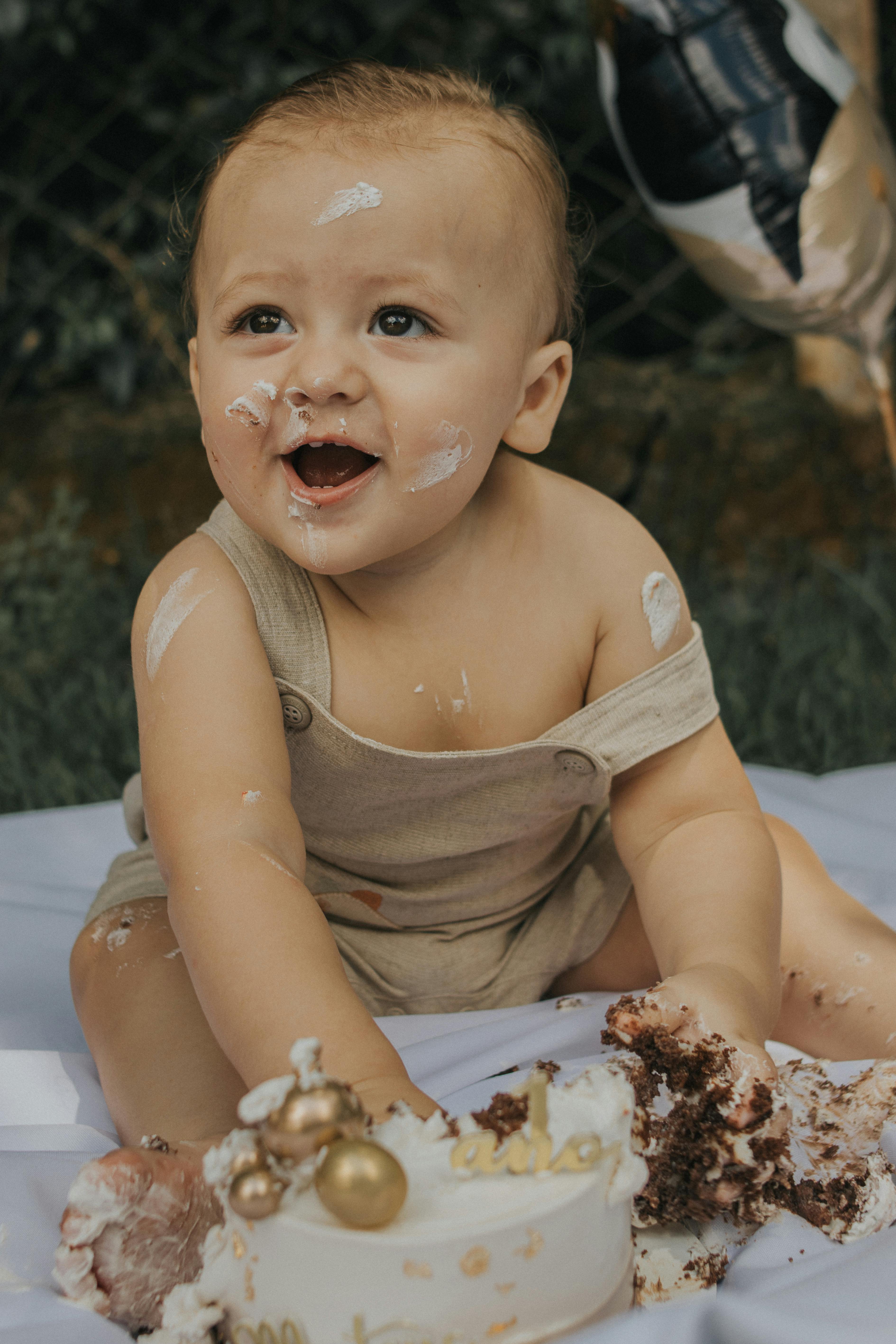 Adorable Baby Enjoying a Messy Birthday Cake · Free Stock Photo