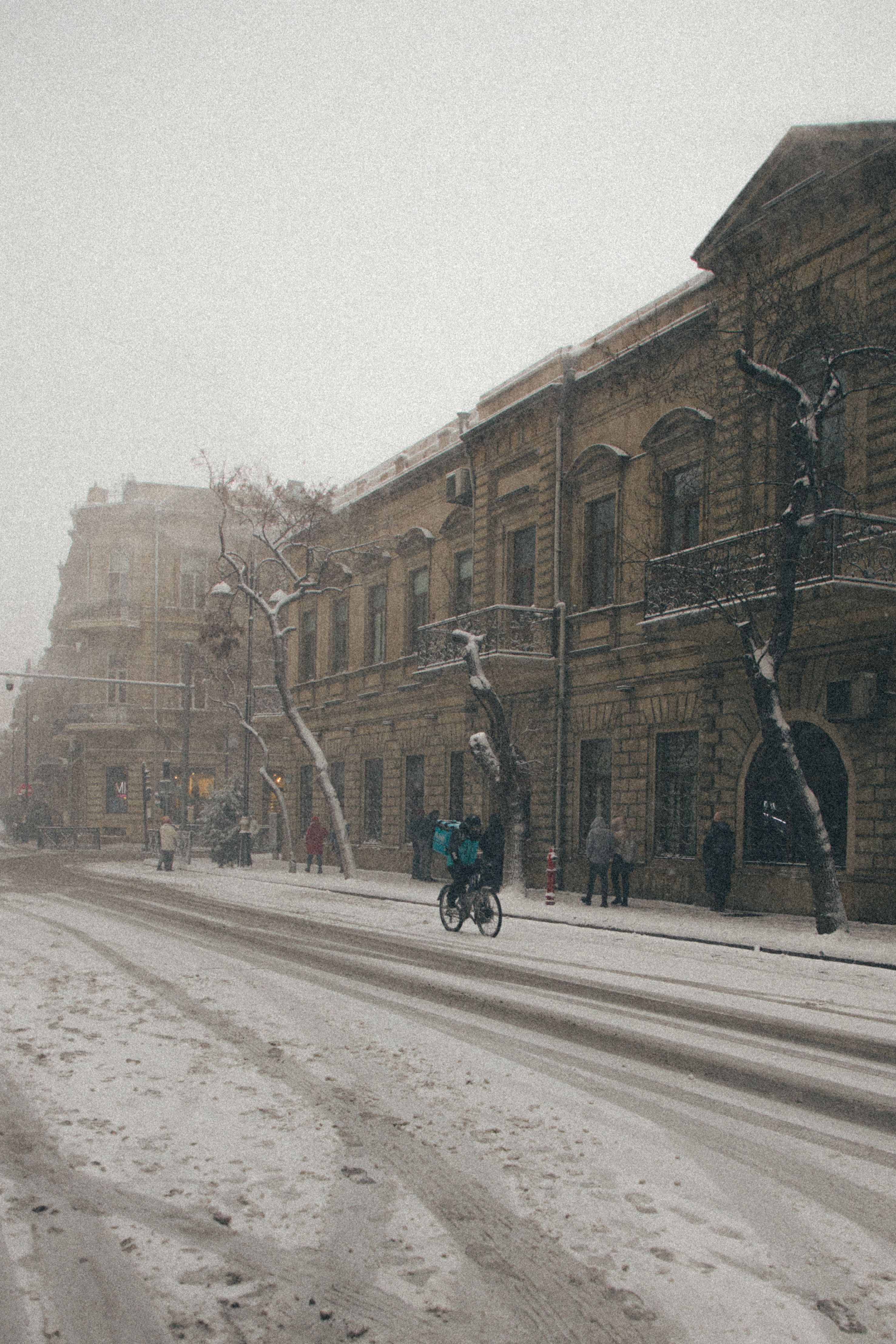 Snowy Urban Street with Historic Architecture · Free Stock Photo