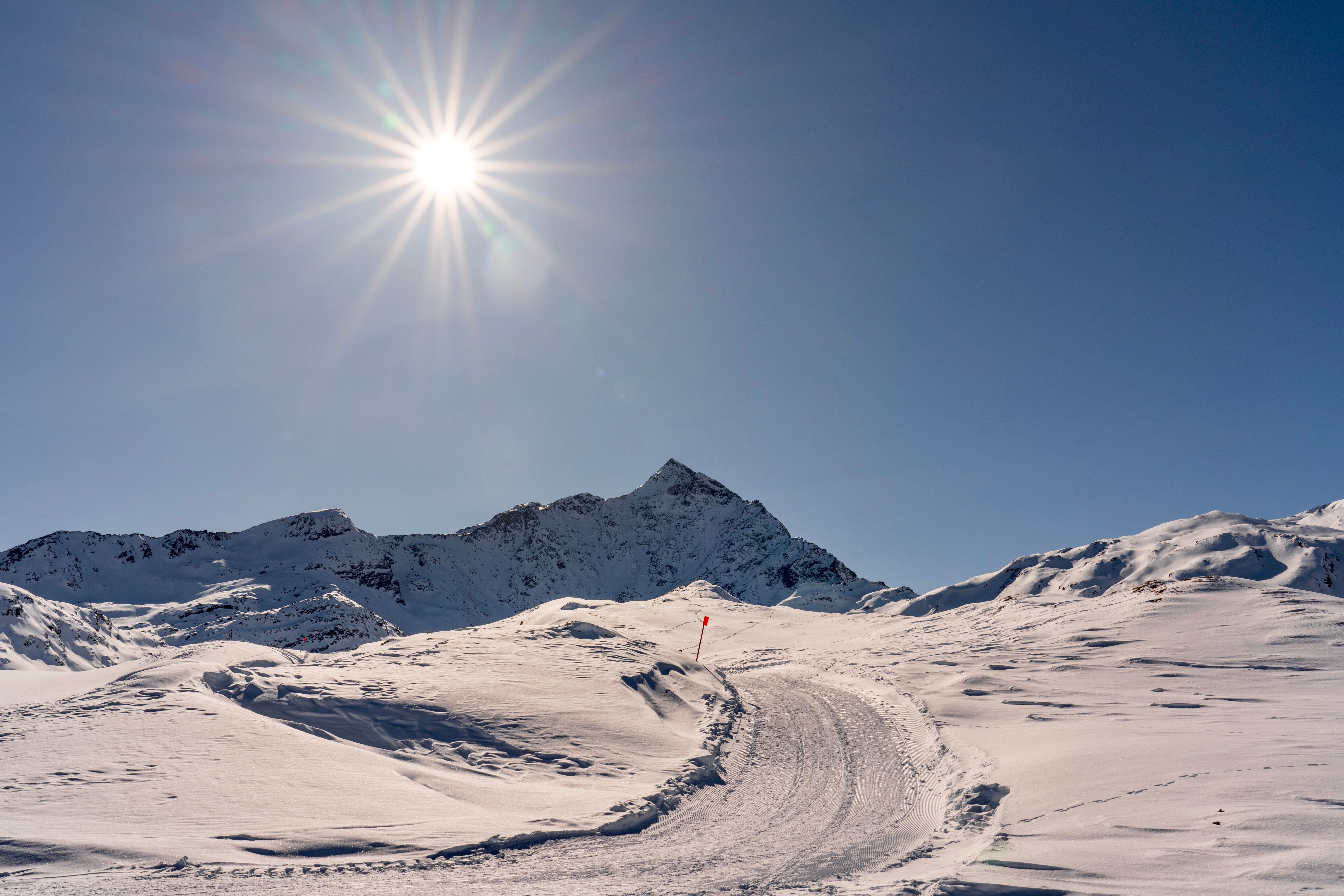 Sunny Snow-Covered Mountain Landscape · Free Stock Photo