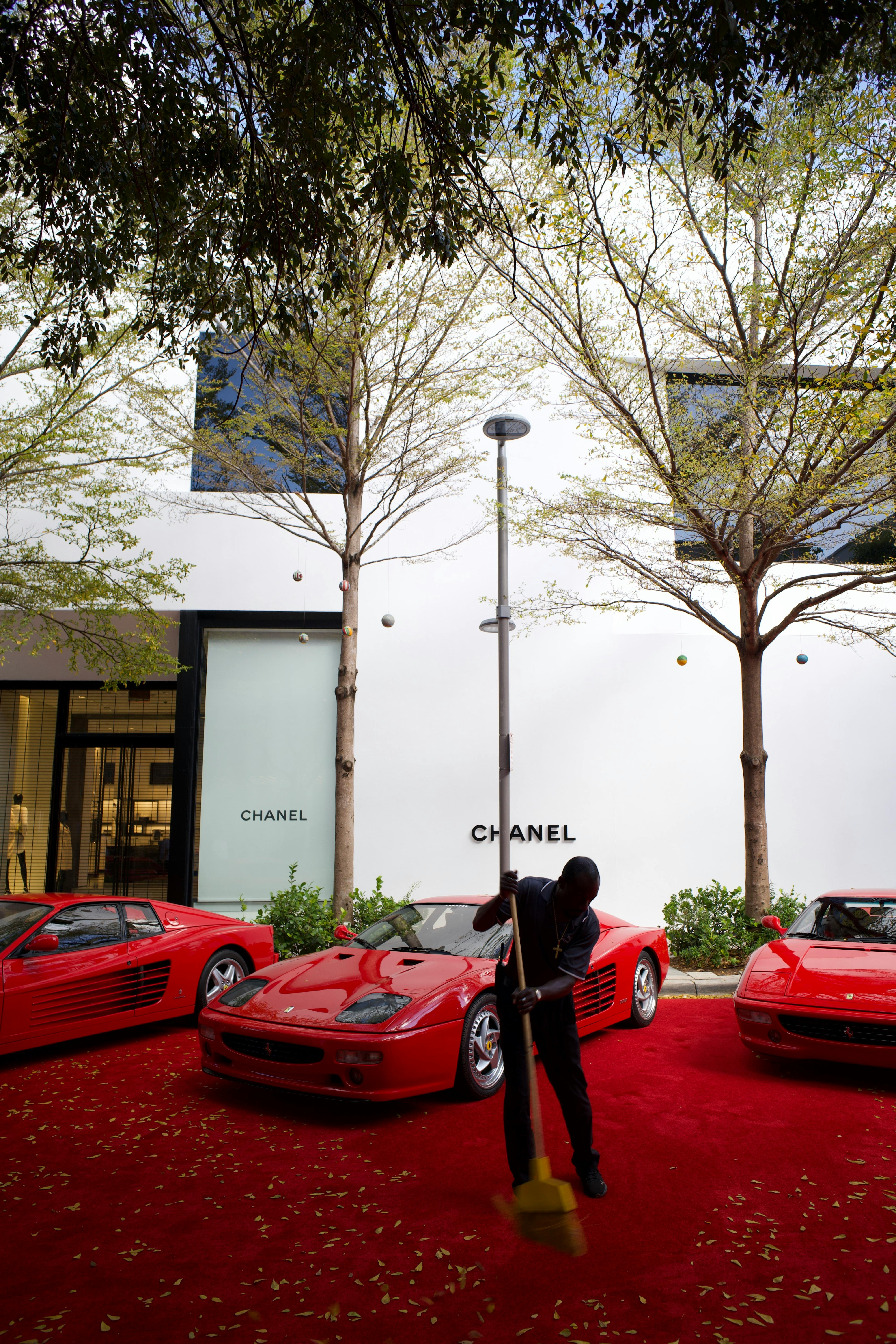 Luxury Cars at Chanel Boutique Outdoors · Free Stock Photo