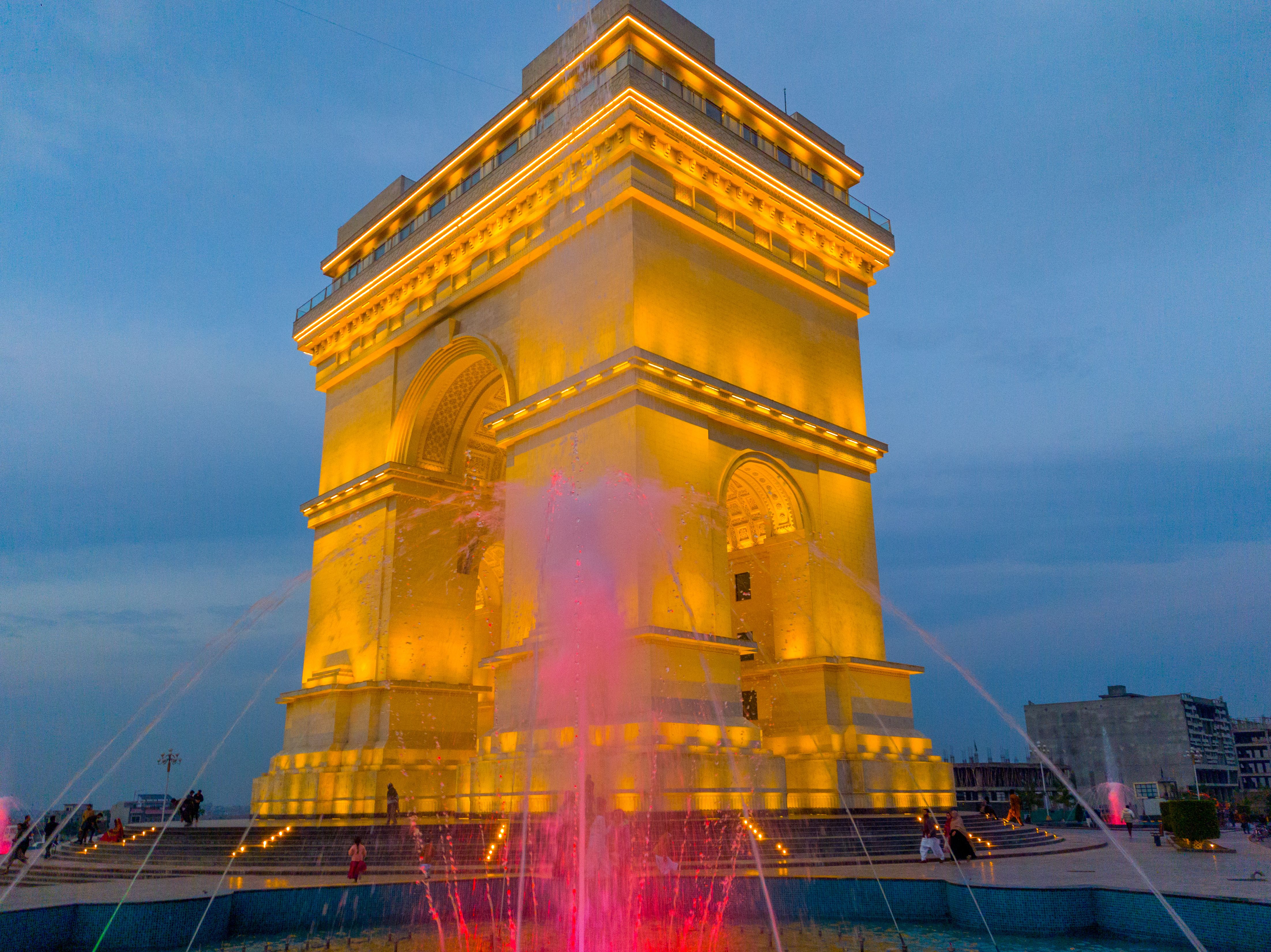 Illuminated Victory Arch with Colorful Fountain at Evening · Free Stock ...