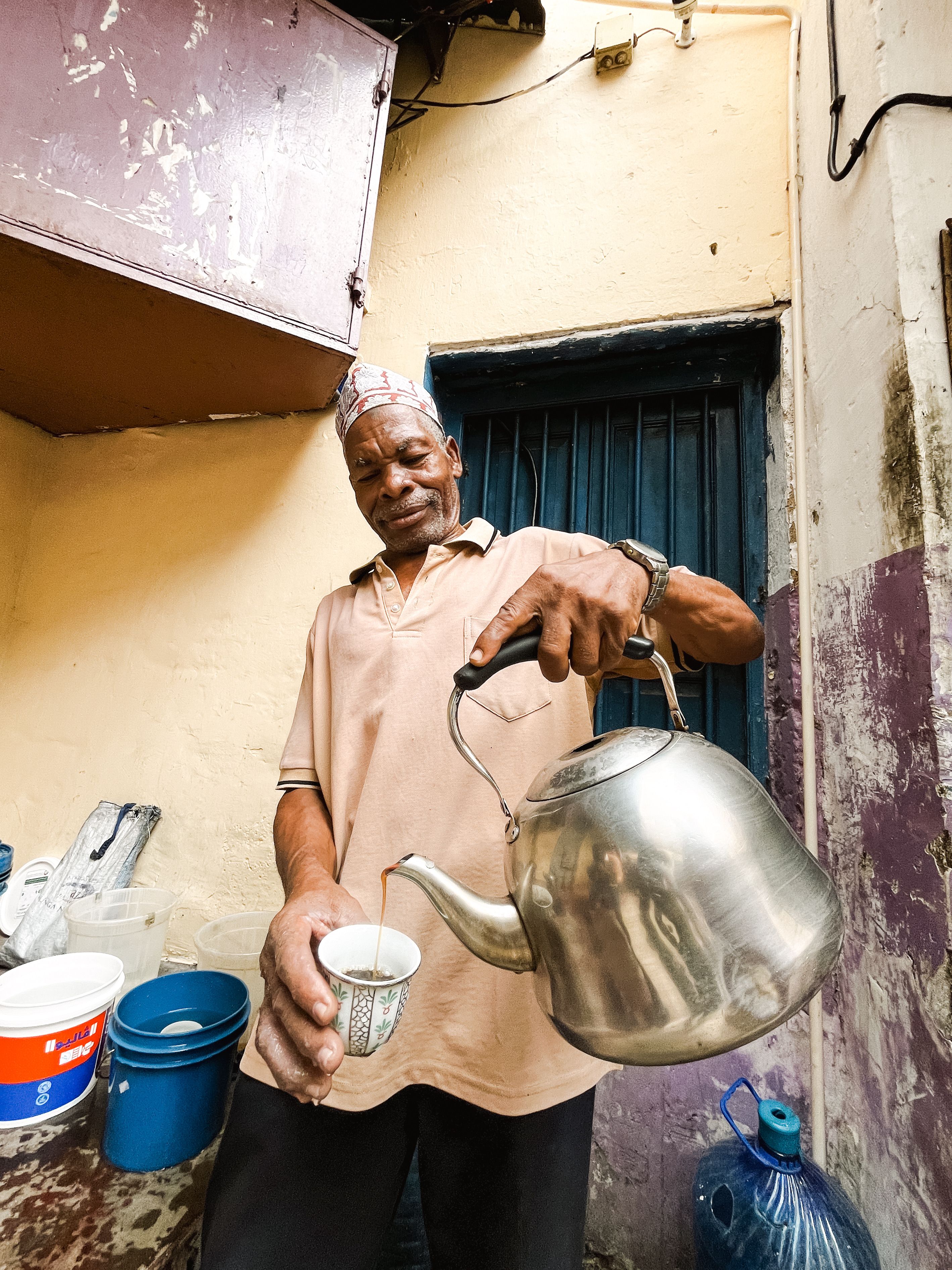 Elderly Man Pouring Tea in Zanzibar · Free Stock Photo