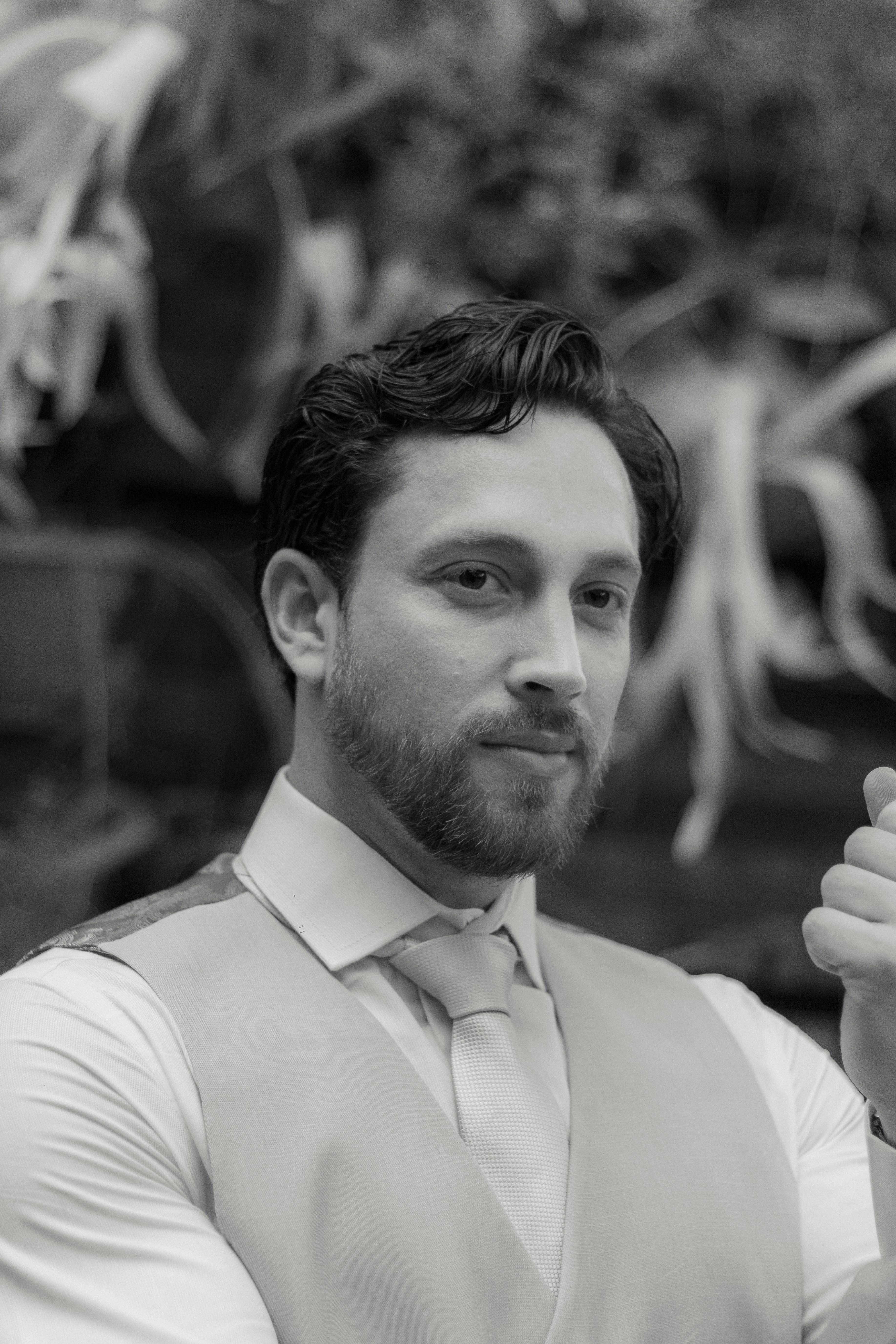 Stylish Man in Vest with Confident Gesture · Free Stock Photo
