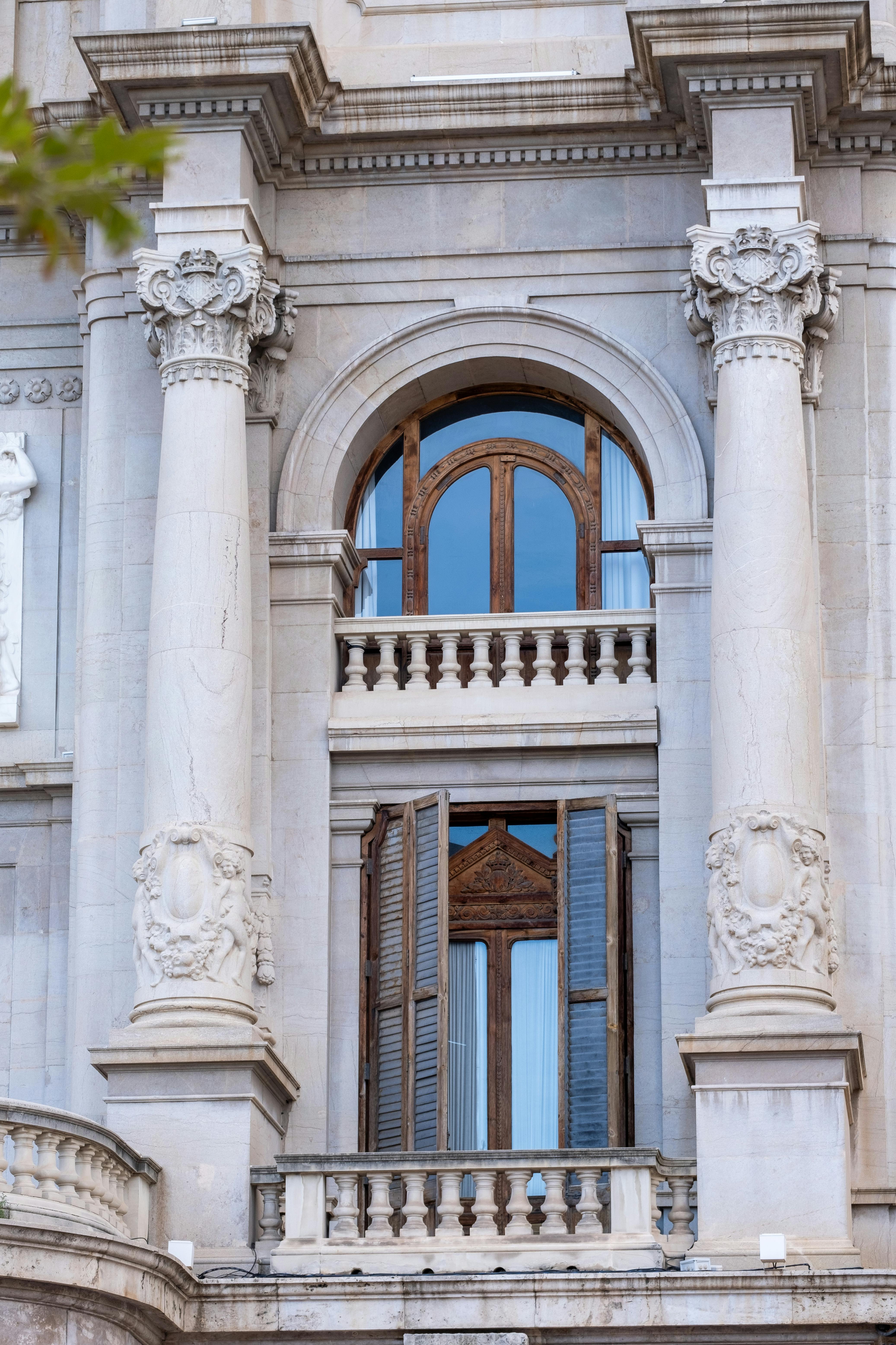 Elegant Spanish Architecture with Ornate Columns · Free Stock Photo