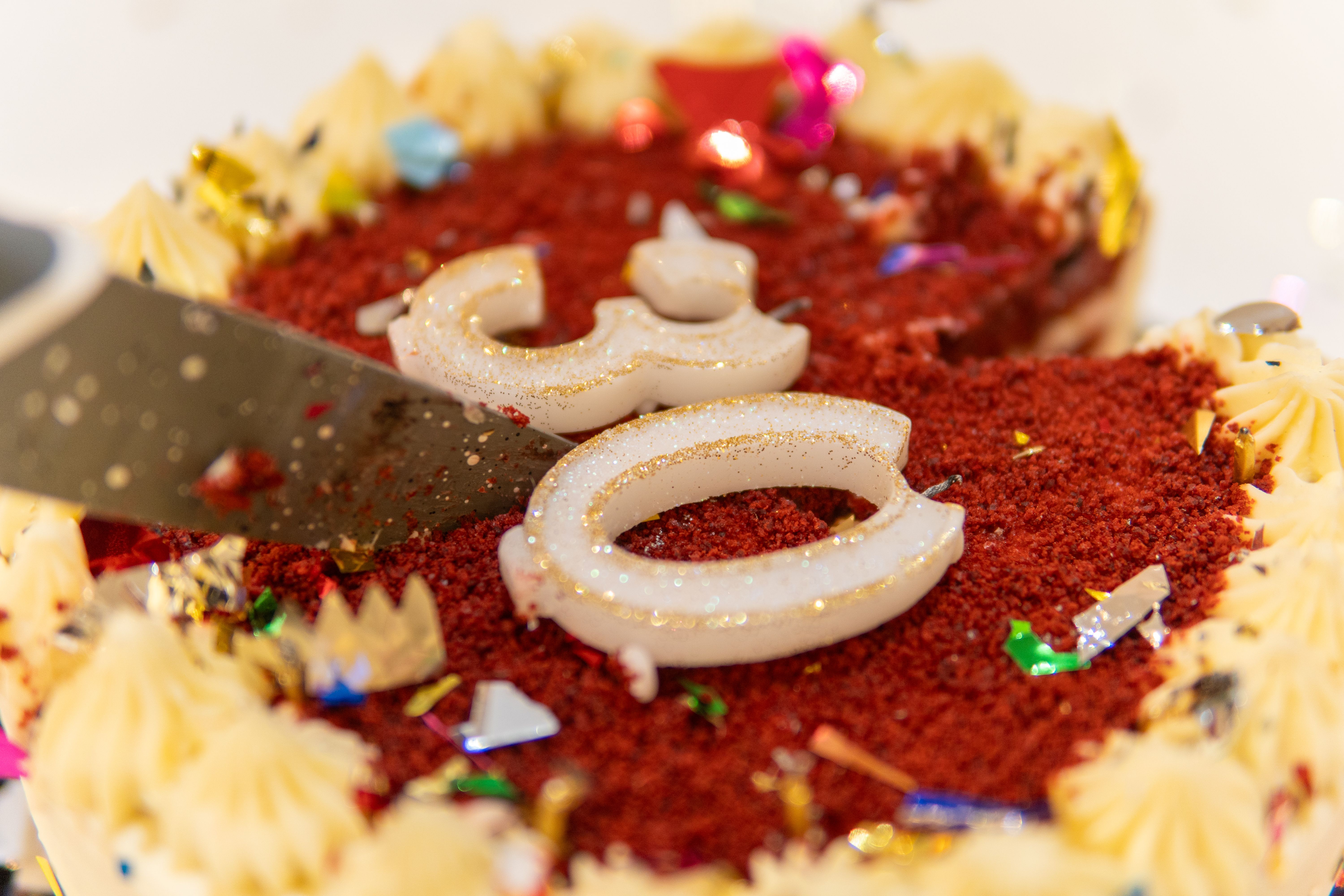 Red Velvet Celebration Cake with Om Symbol · Free Stock Photo