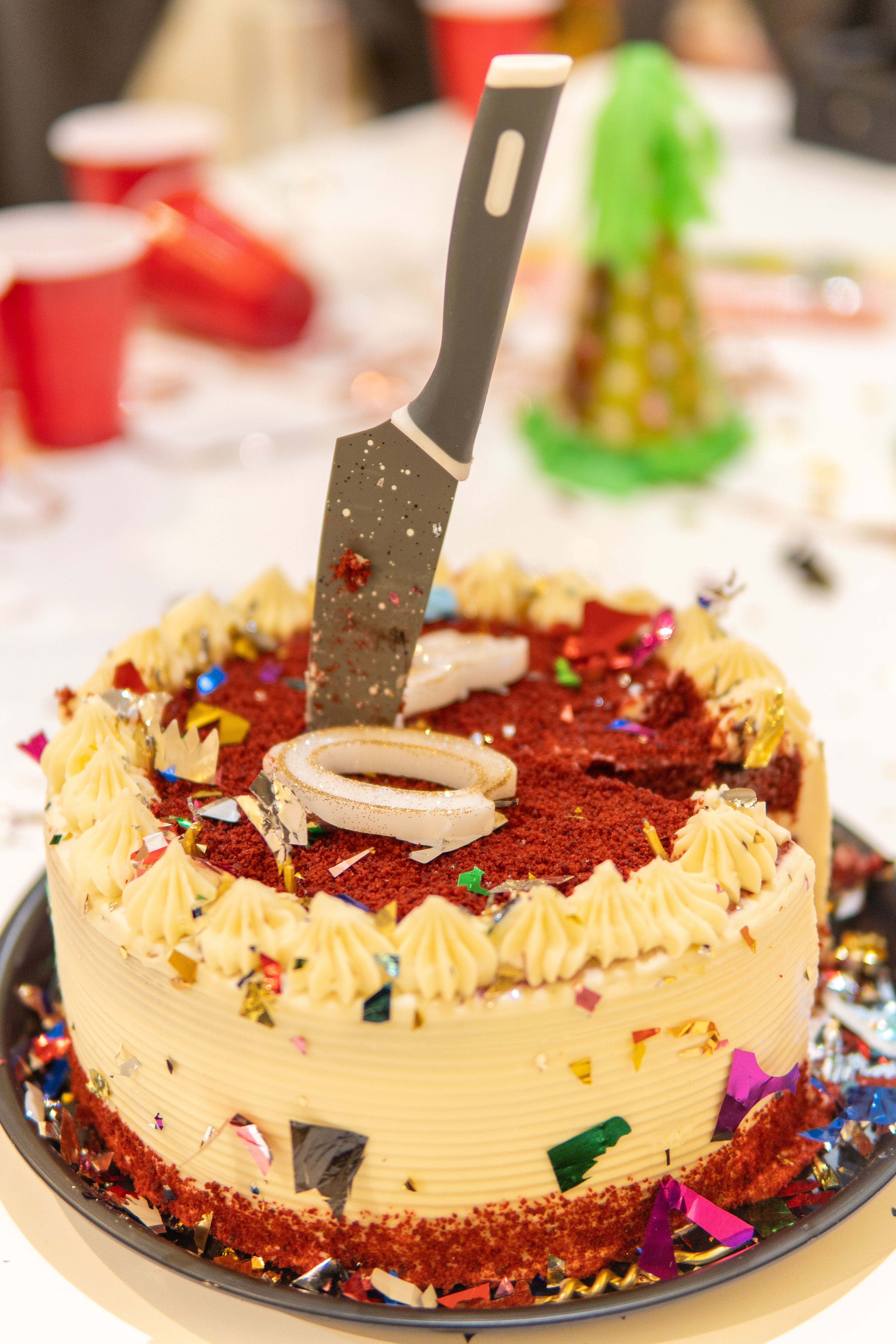 Colorful Celebration Cake with Knife in Topping · Free Stock Photo