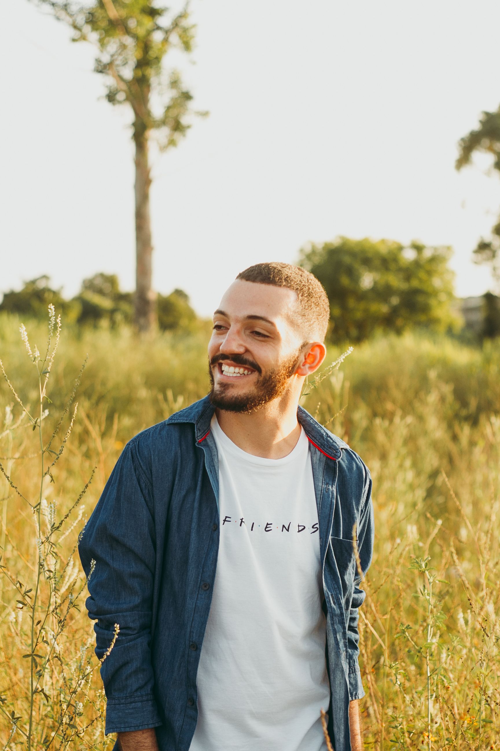 Young Man Enjoying a Sunny Day Outdoors · Free Stock Photo