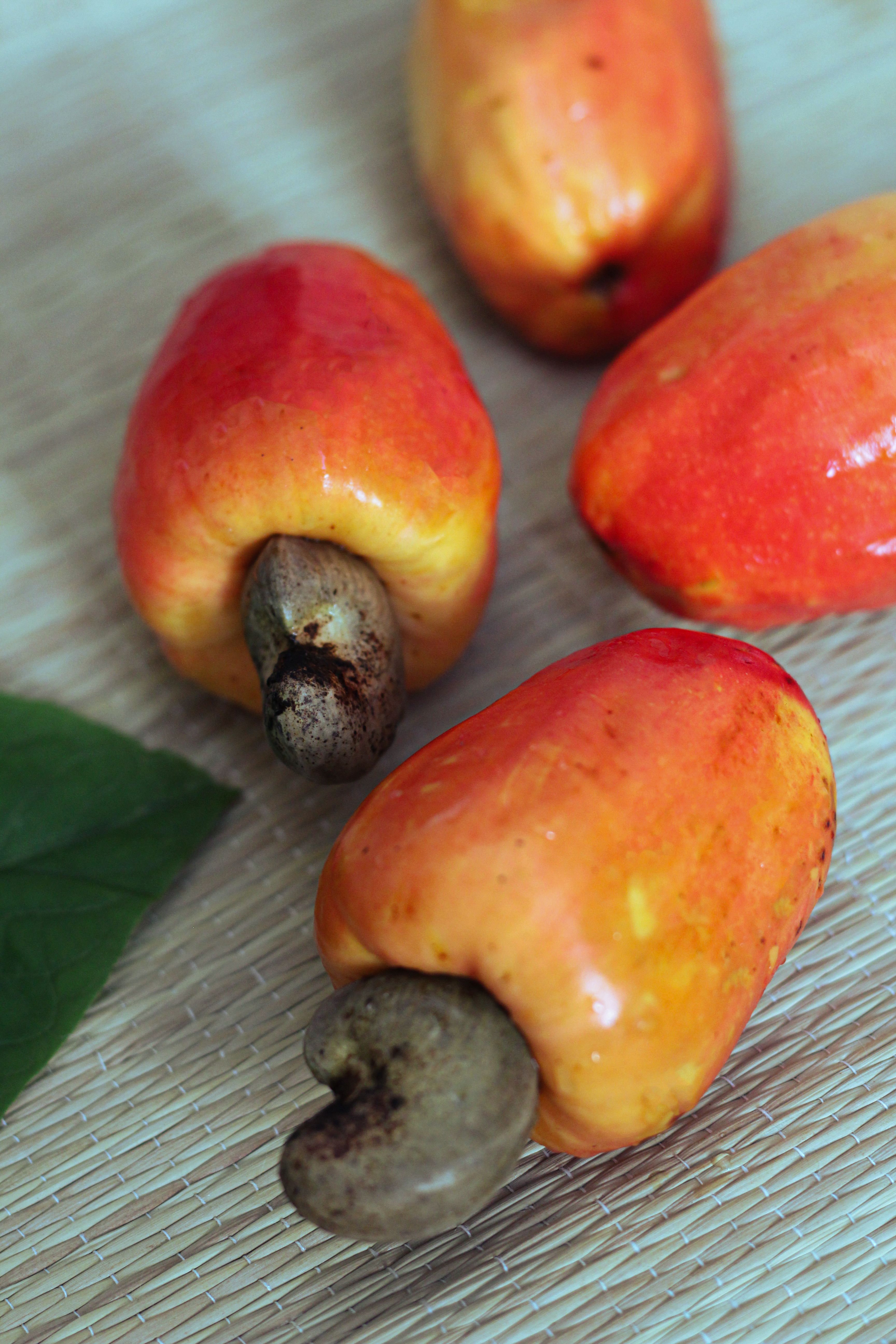 Ripe Cashew Fruits on Natural Matting · Free Stock Photo