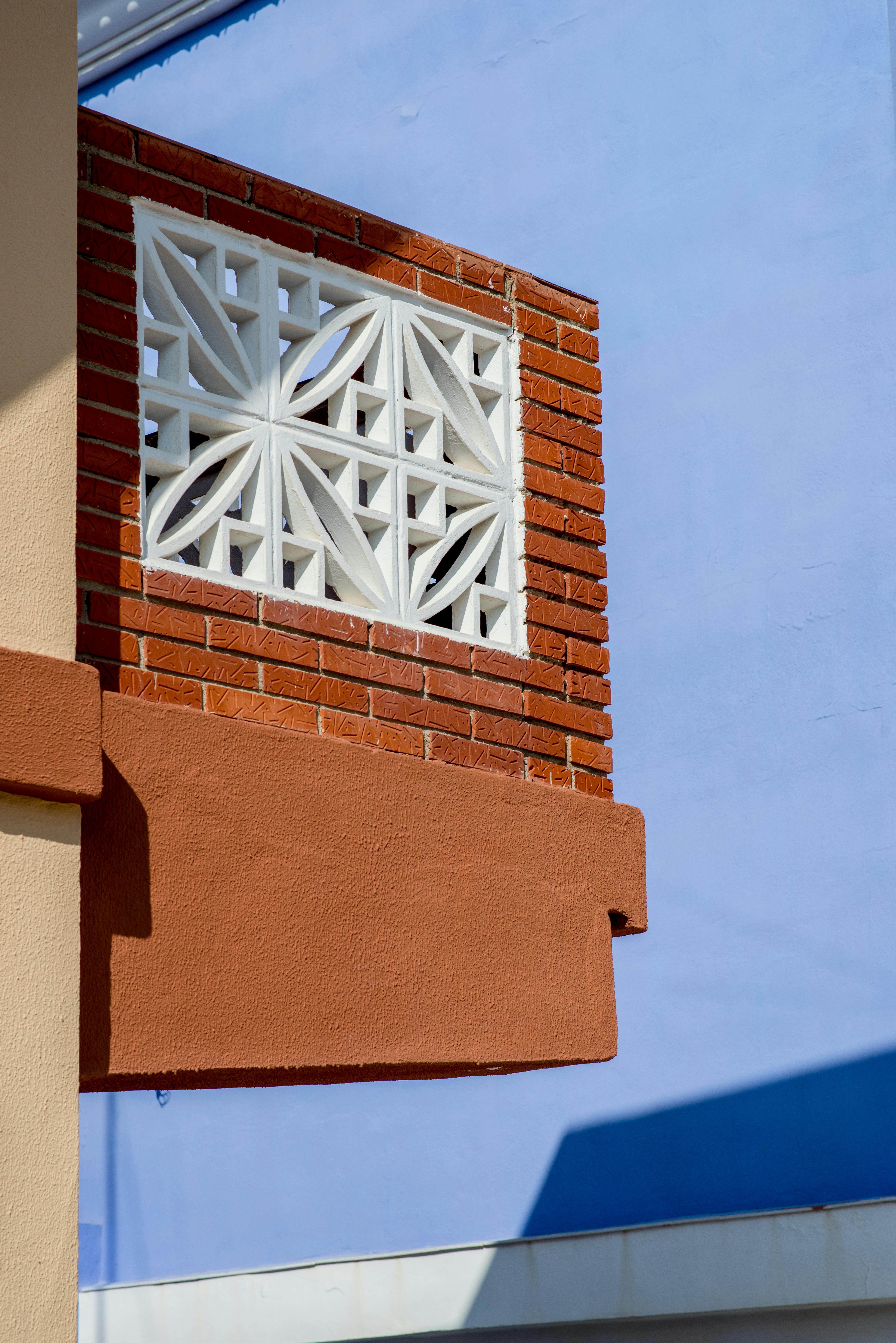 Modern Architectural Facade with Geometric Patterns · Free Stock Photo