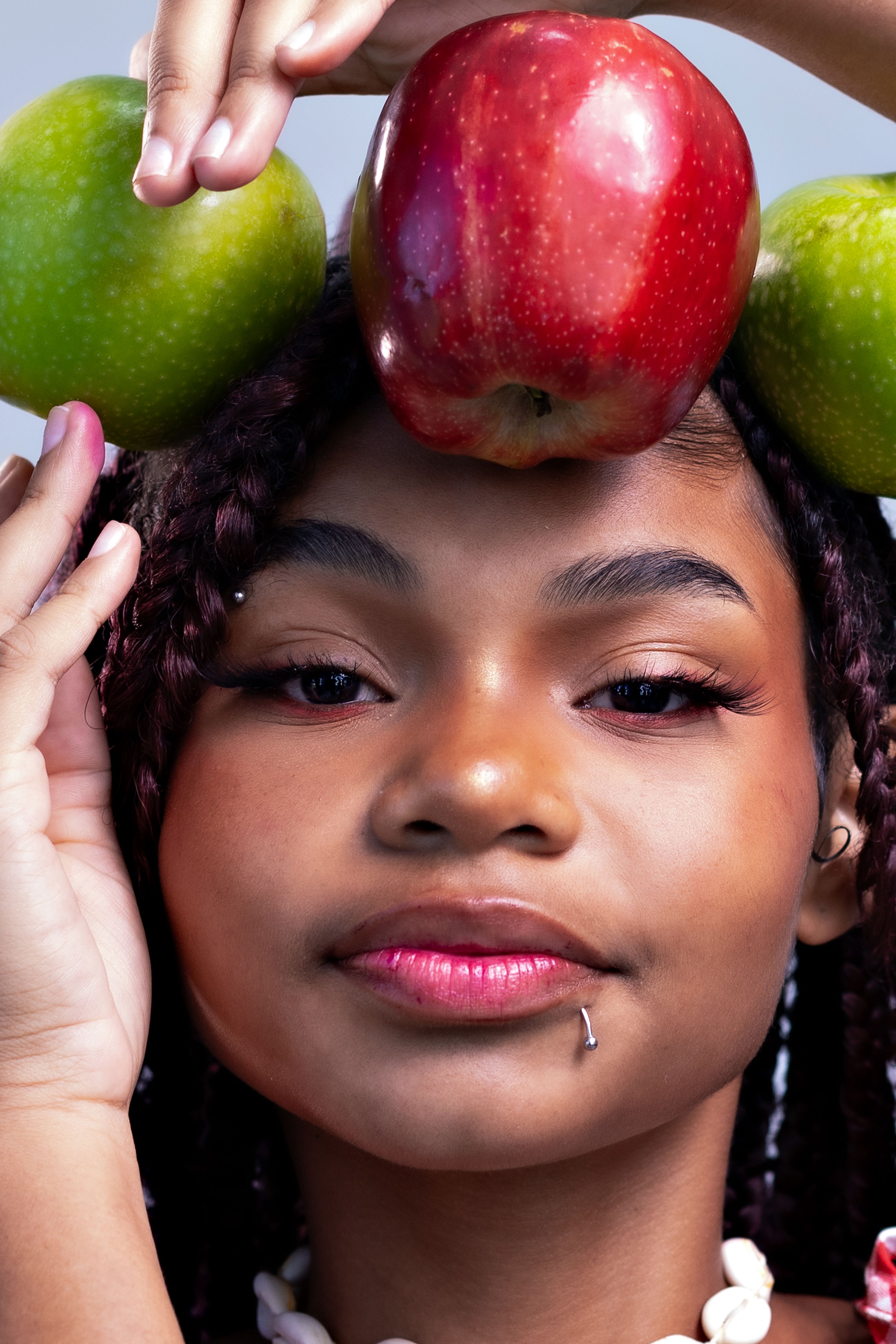 Portrait of Woman Balancing Apples on Her Head · Free Stock Photo