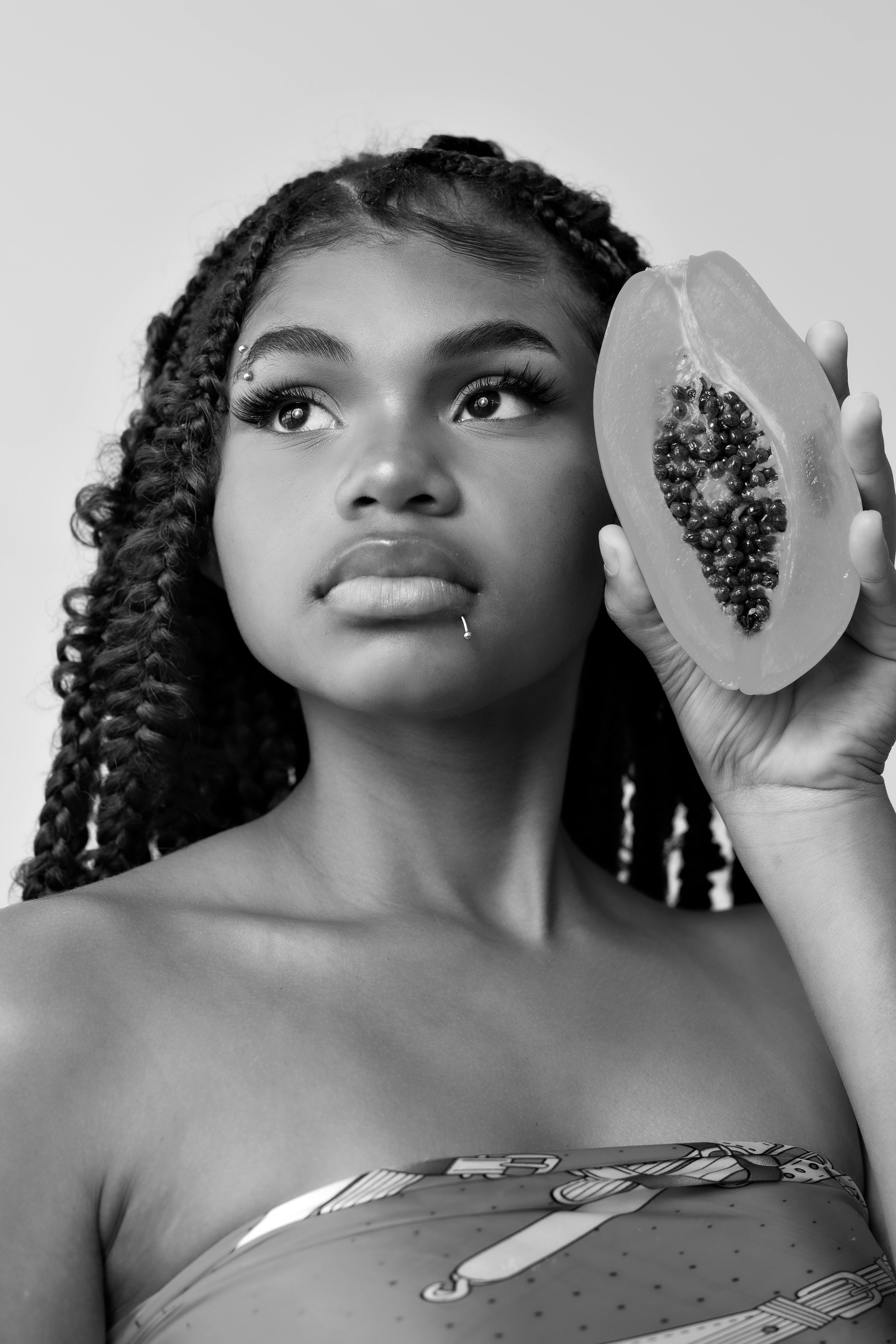 Woman Holding Papaya in Black and White Portrait · Free Stock Photo