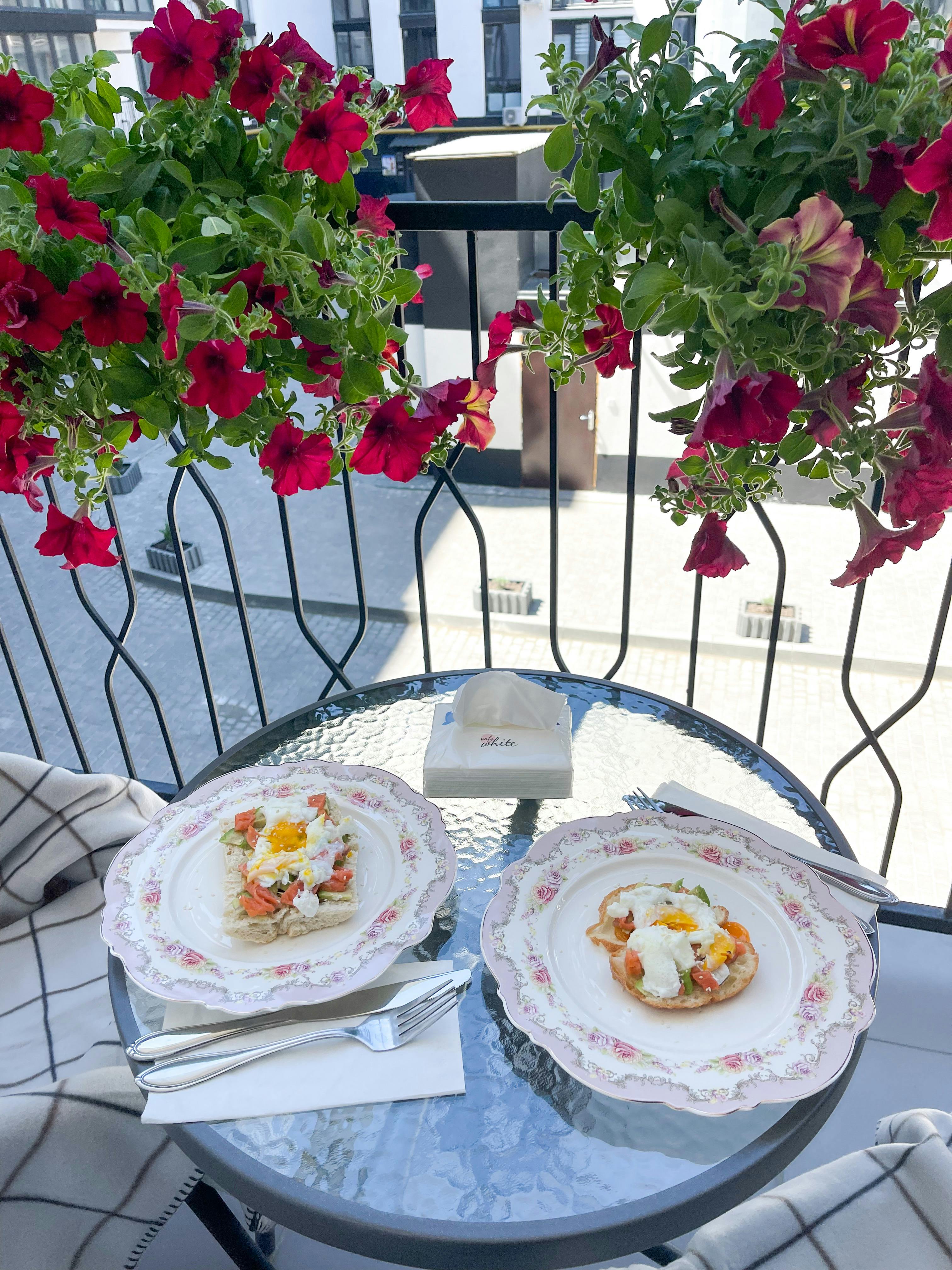Cozy Balcony Breakfast with Tacos and Flowers · Free Stock Photo