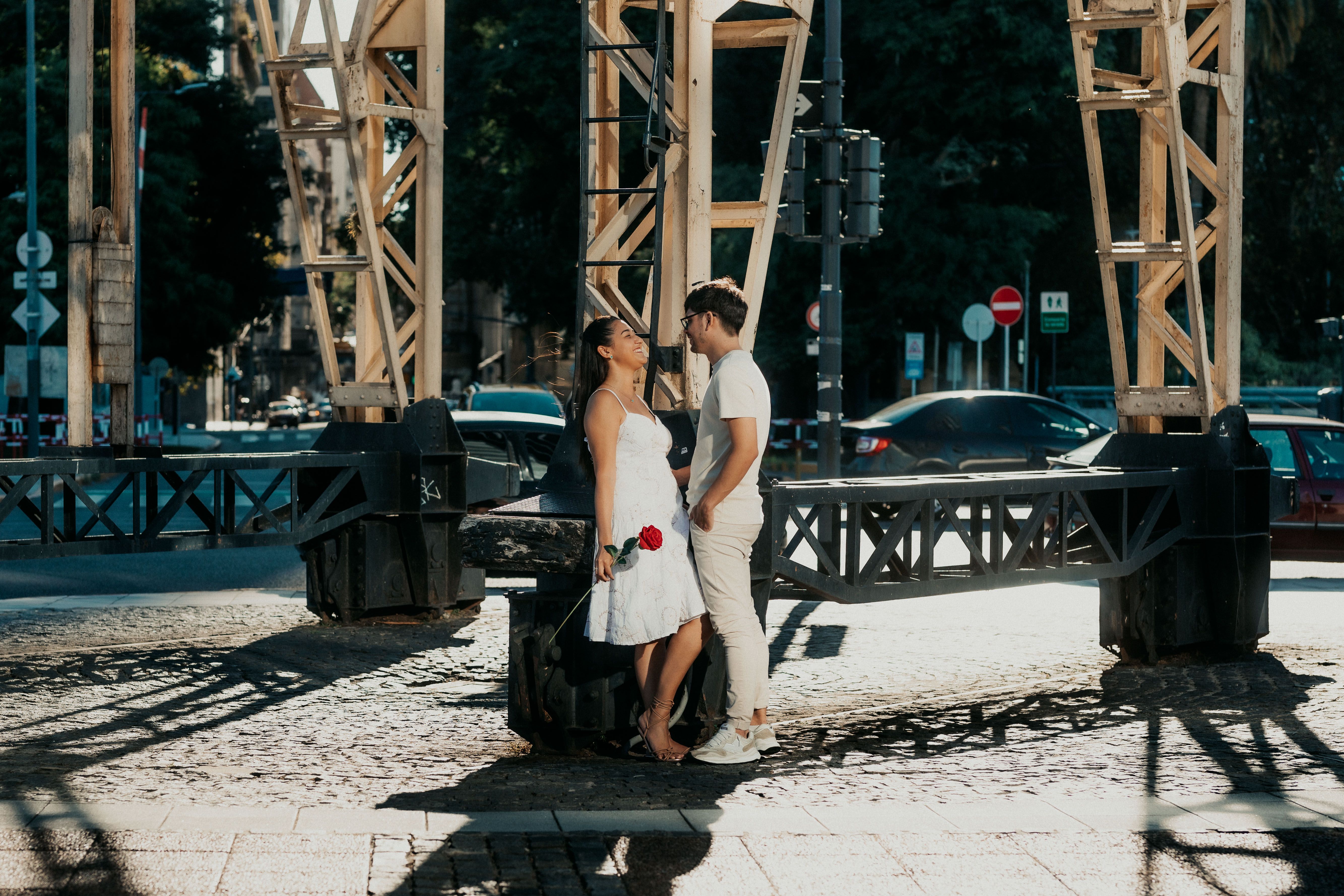 Romantic Couple Under Sunlit Bridge in Buenos Aires · Free Stock Photo
