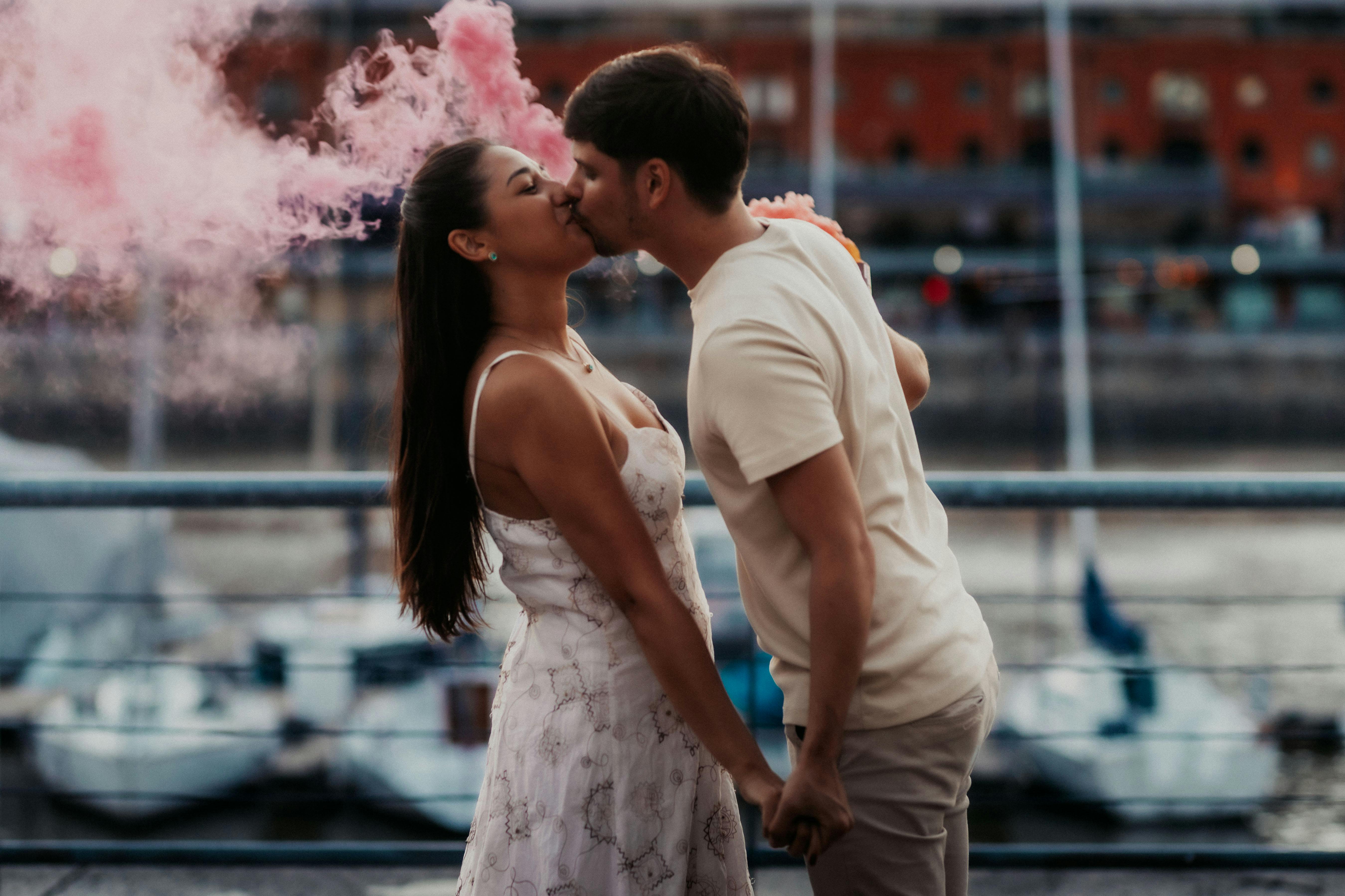 Romantic Couple Kissing by Waterfront in Buenos Aires · Free Stock Photo