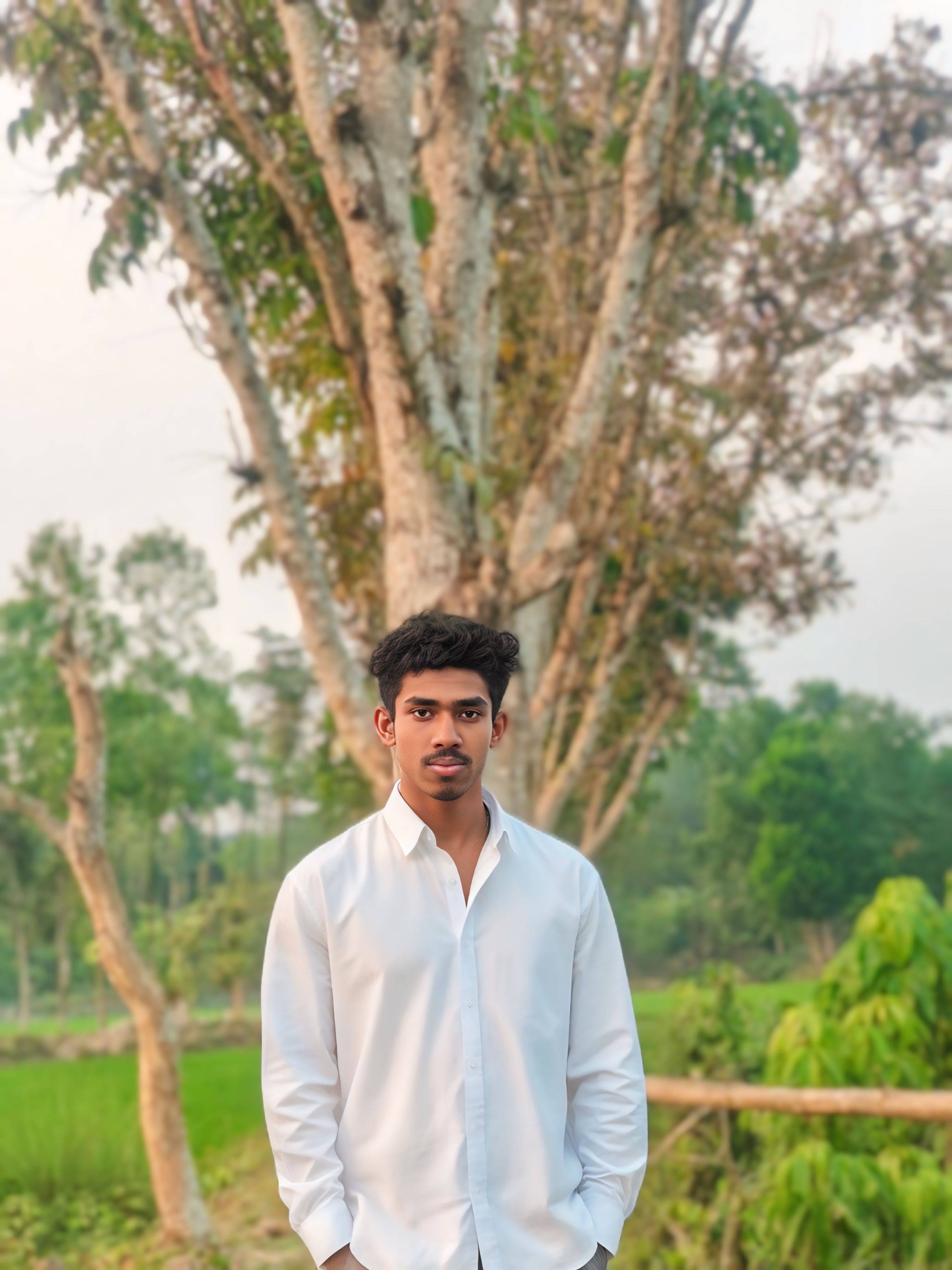 Young Man in Nature with Trees in Background · Free Stock Photo