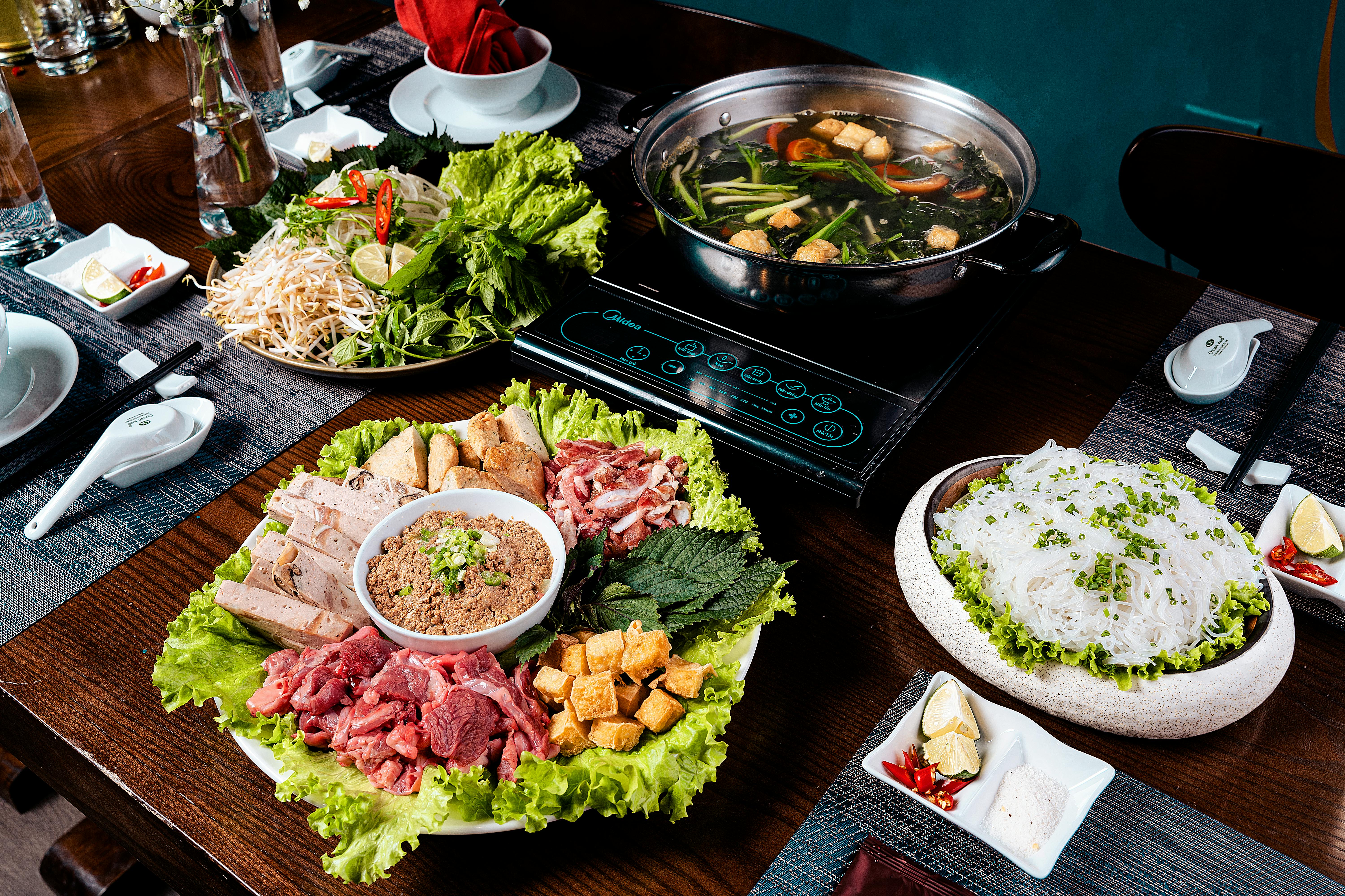 Traditional Vietnamese Hot Pot Dining Experience · Free Stock Photo