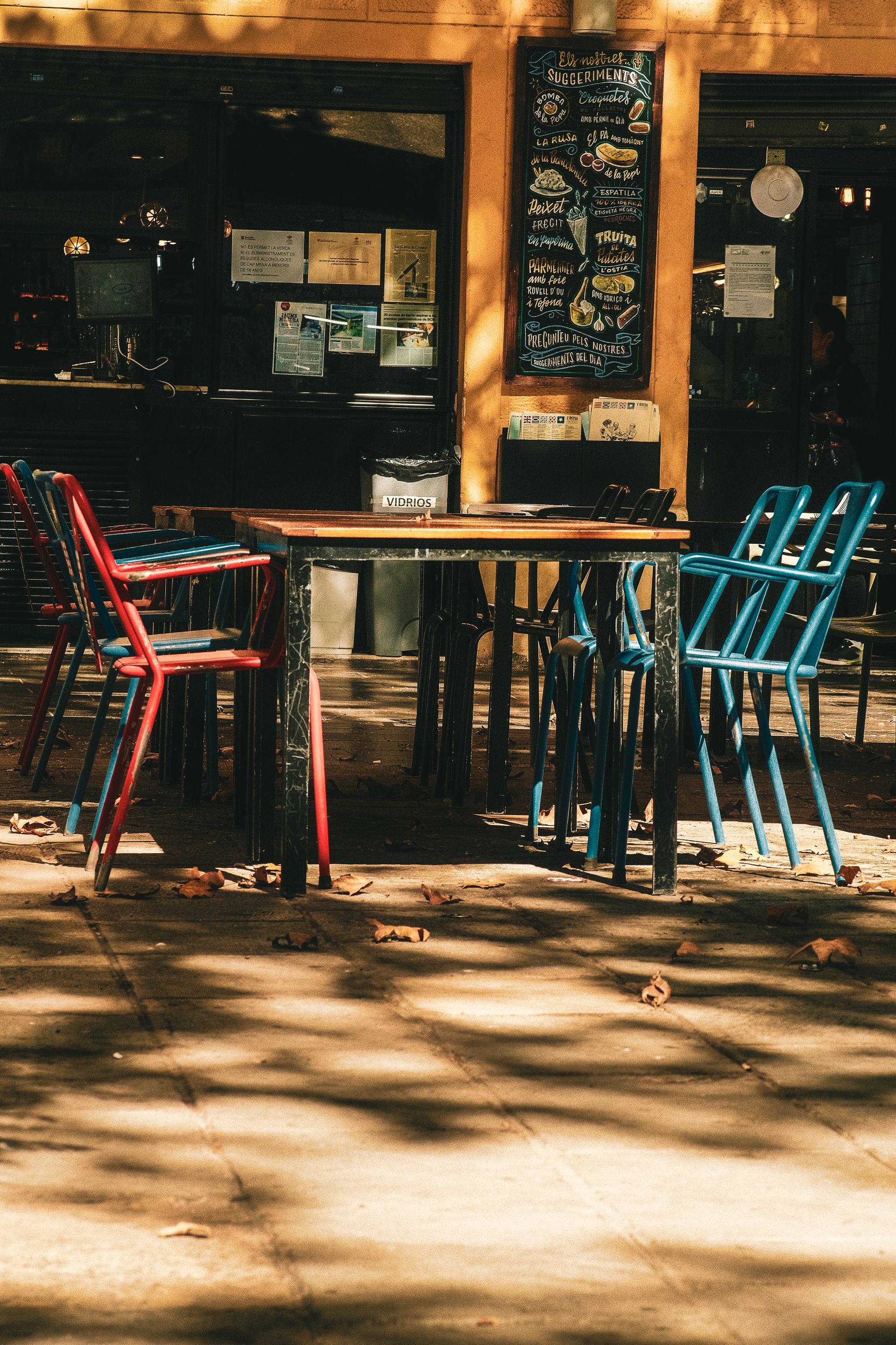 Outdoor Café Seating with Colorful Chairs · Free Stock Photo
