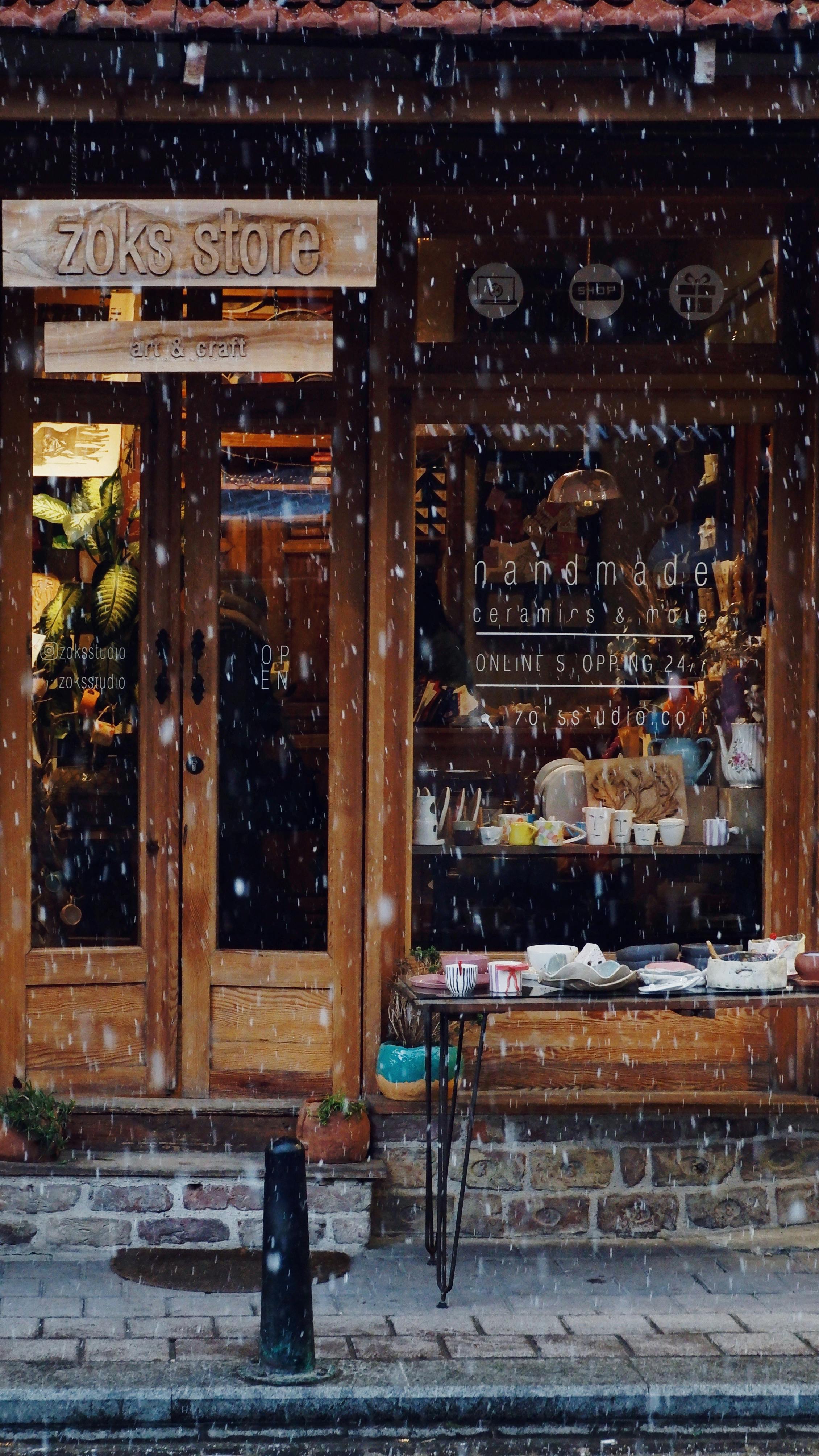 Cozy Handmade Storefront in Winter Snowfall · Free Stock Photo