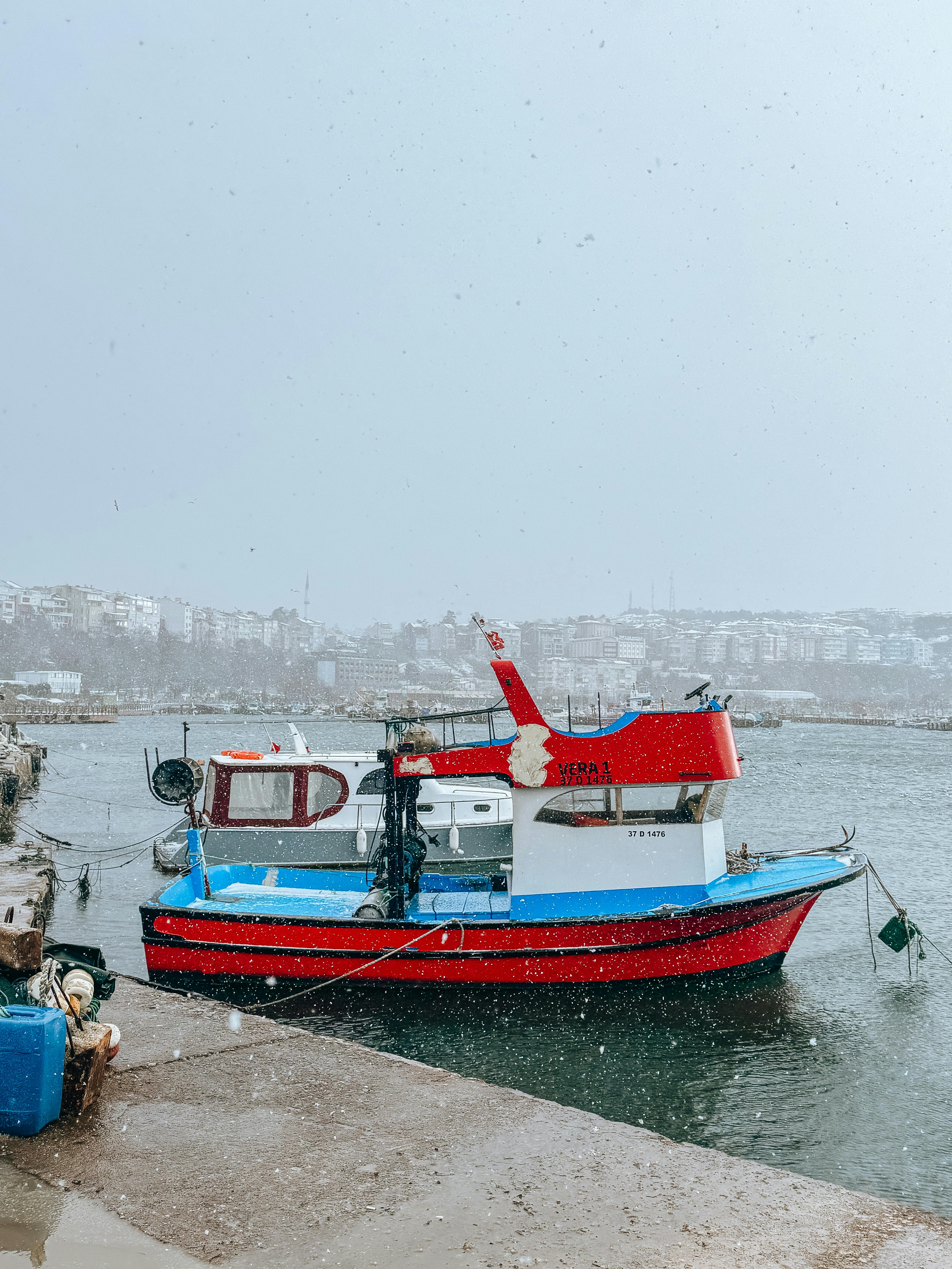 Fishing Boat in Snowy Harbor Captured Elegantly · Free Stock Photo