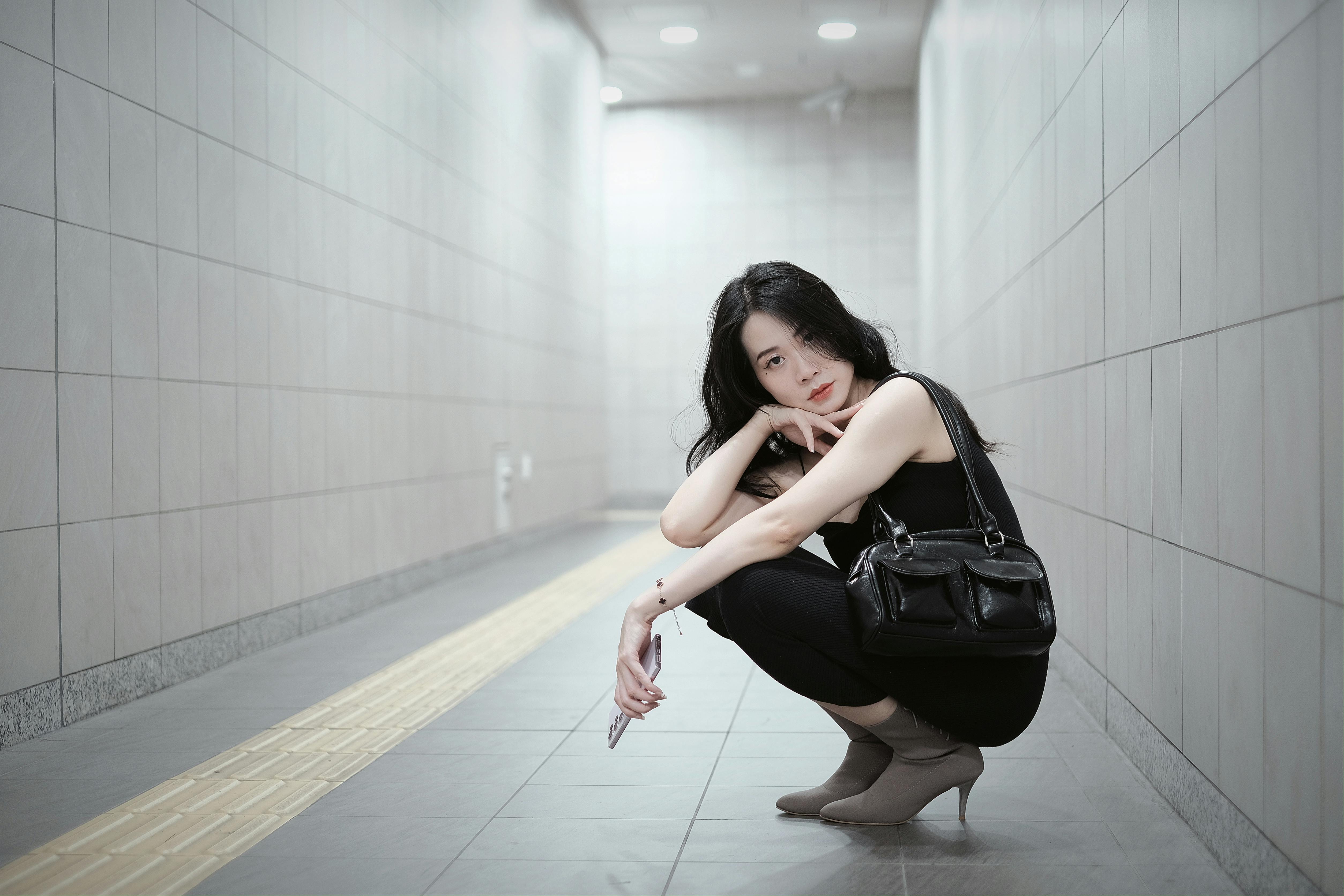 Woman Posing in Subway Tunnel with Stylish Attire · Free Stock Photo