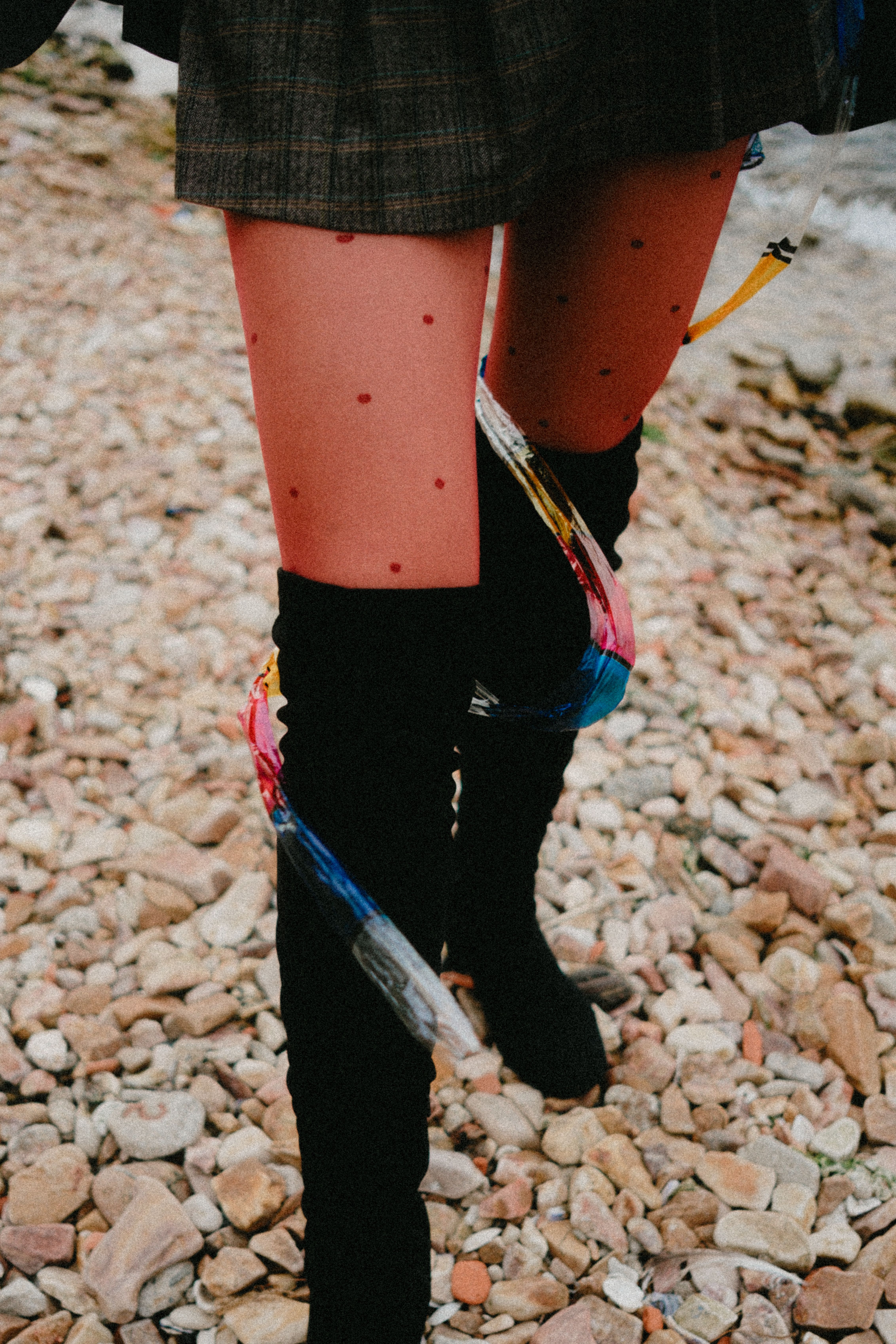 Artistic Fashion Shot of Legs on Rocky Beach · Free Stock Photo