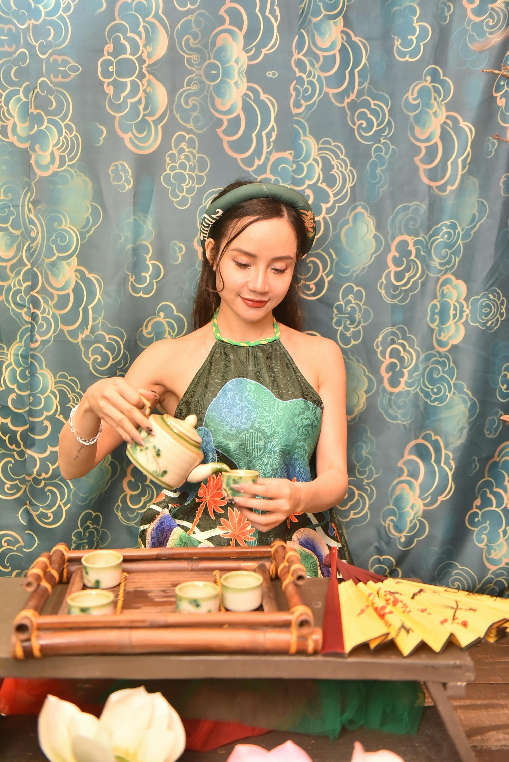Woman in Traditional Dress Preparing Tea Ceremony · Free Stock Photo
