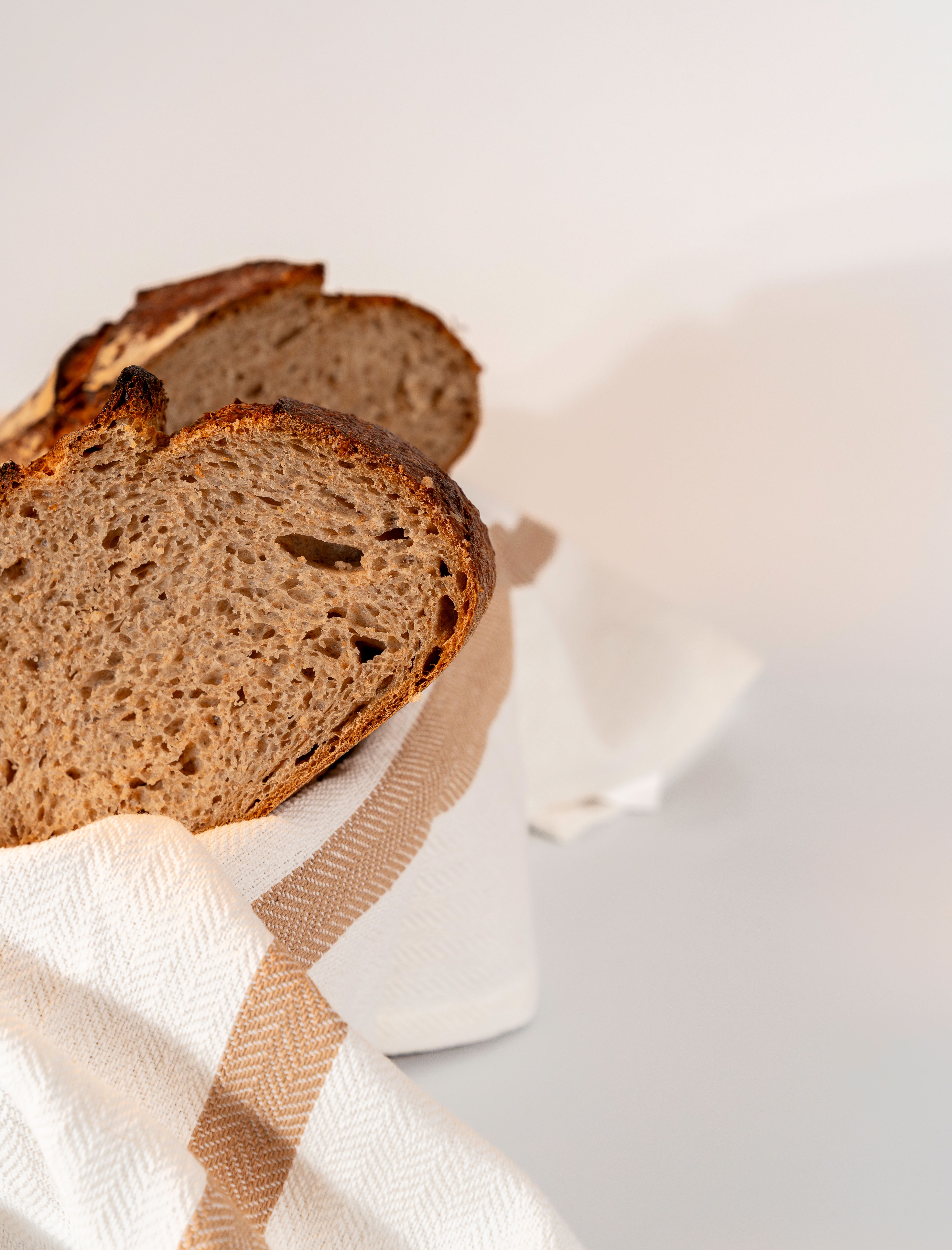 Artisan Sourdough Bread on Linen Cloth · Free Stock Photo