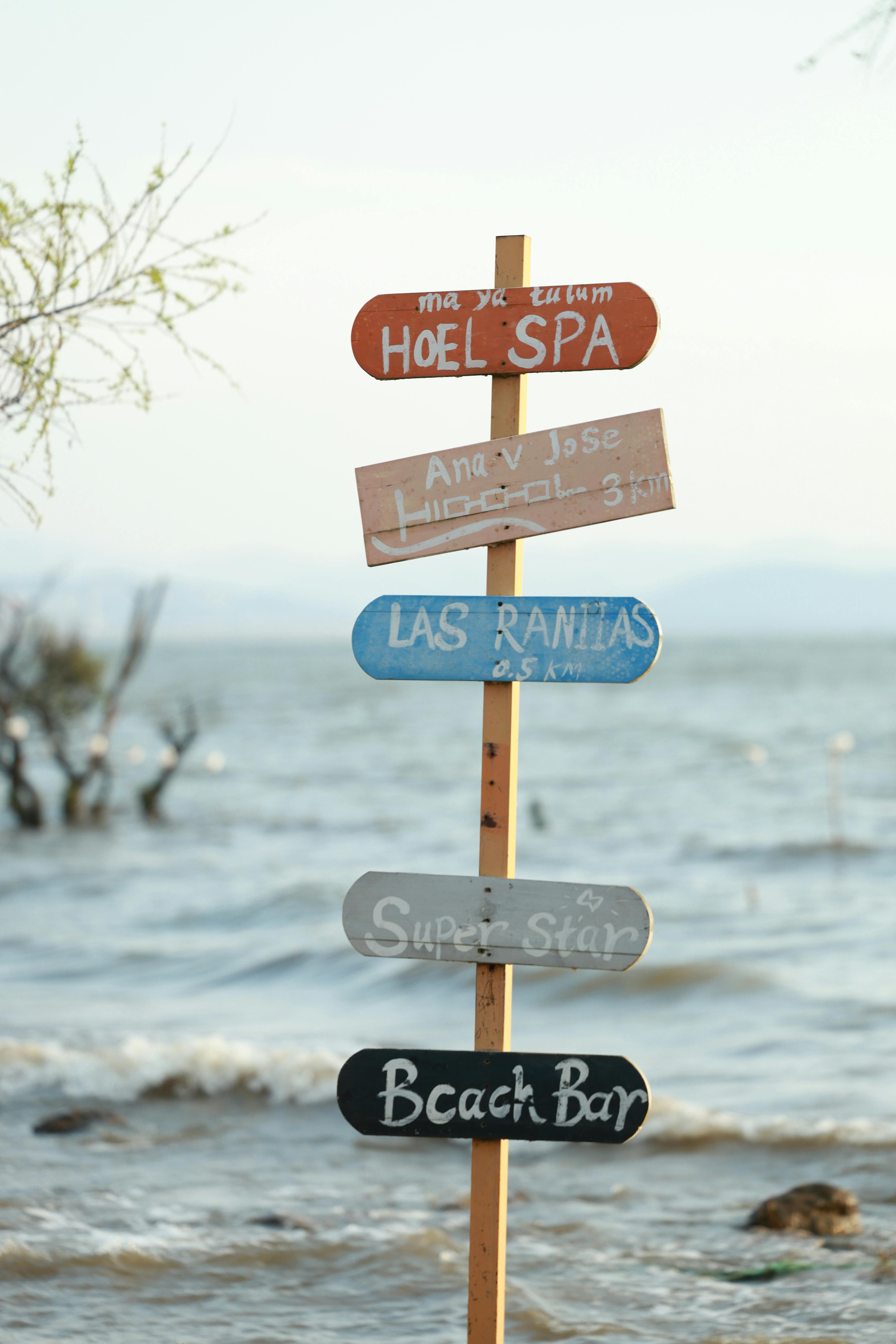 Rustic Beach Signpost by the Sea · Free Stock Photo