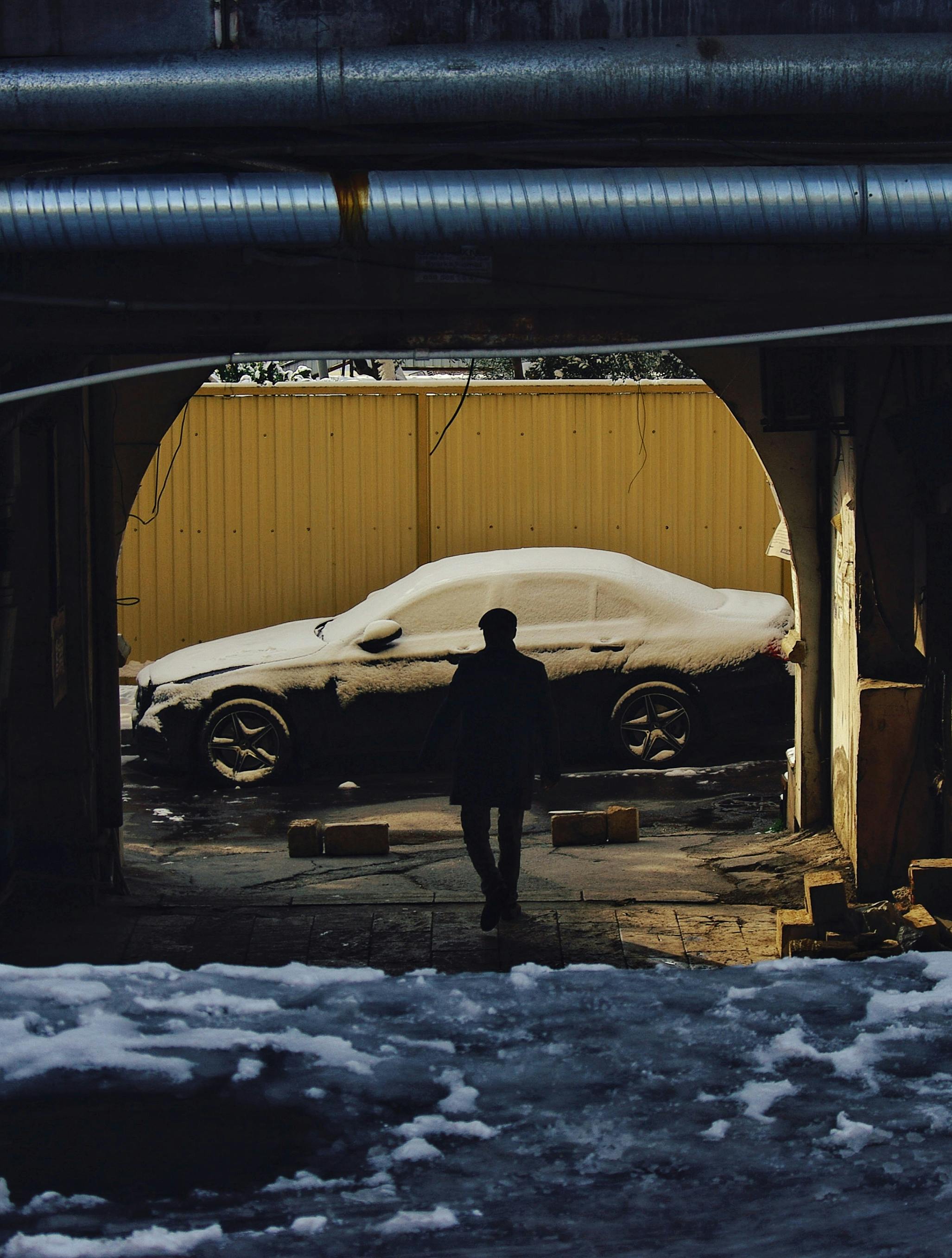Silhouette in Snowy Urban Alleyway · Free Stock Photo