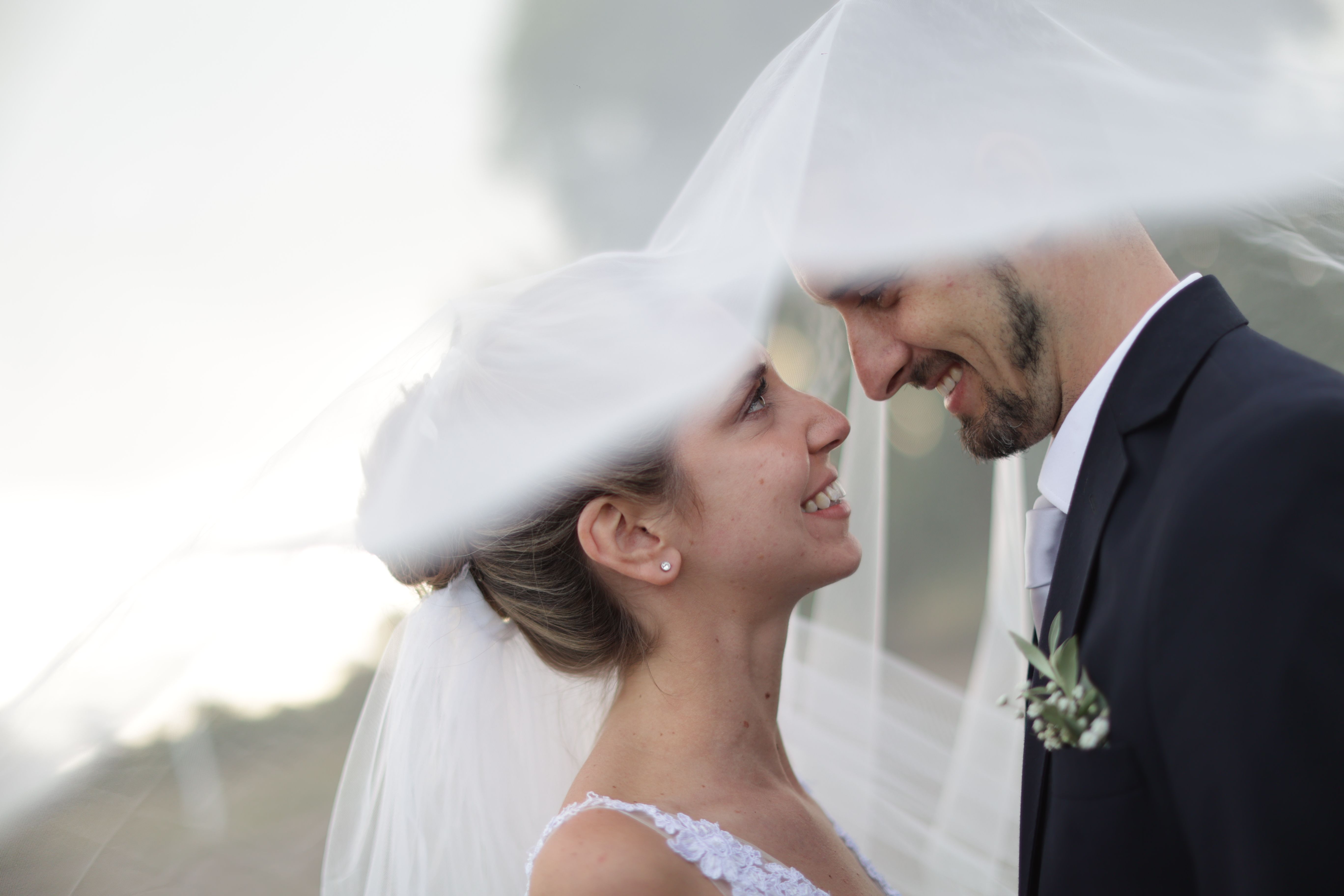 Crop young newlyweds bonding in light wedding studio · Free Stock Photo