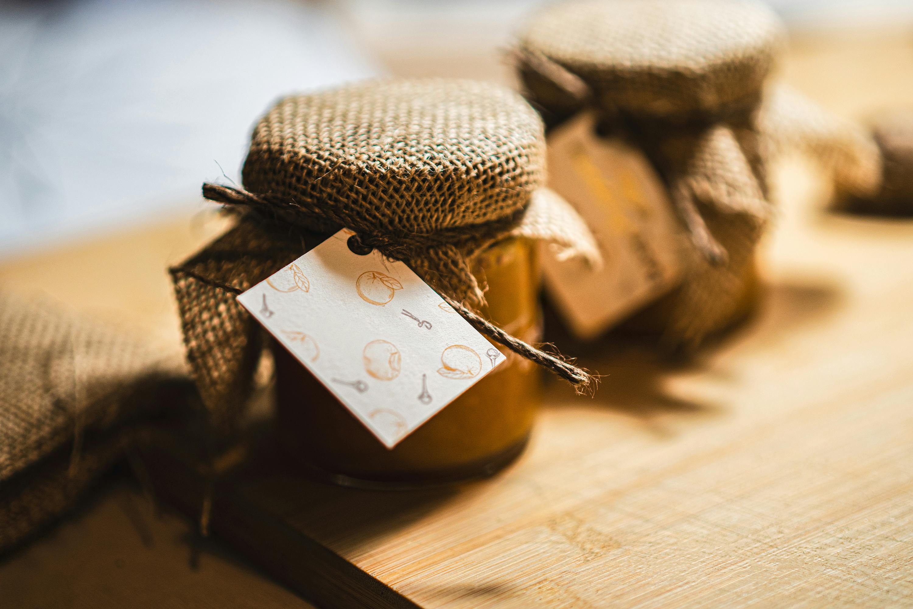 Rustic Homemade Jam in Burlap-Wrapped Jars · Free Stock Photo