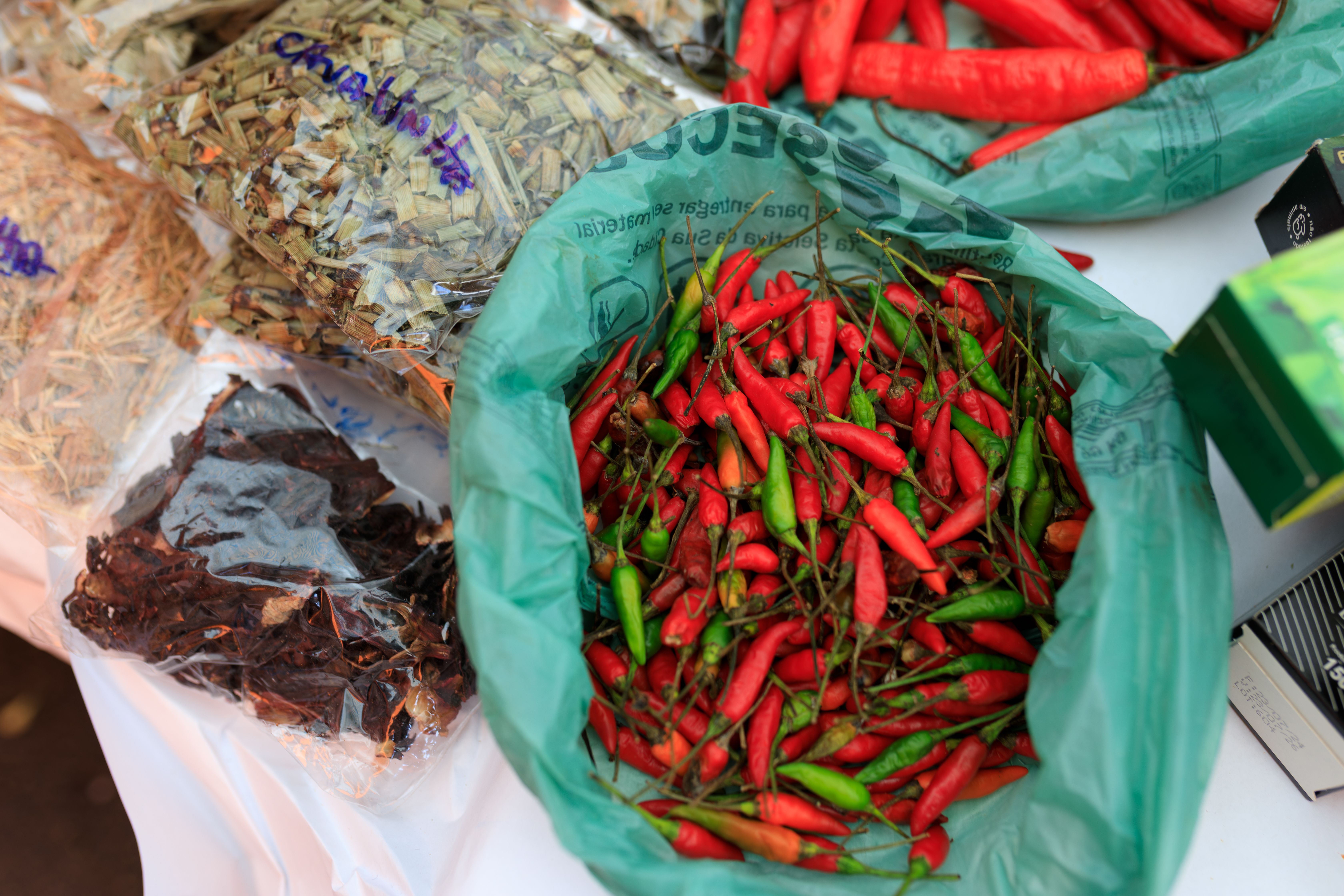 Colorful Spices and Peppers at a Market Table · Free Stock Photo