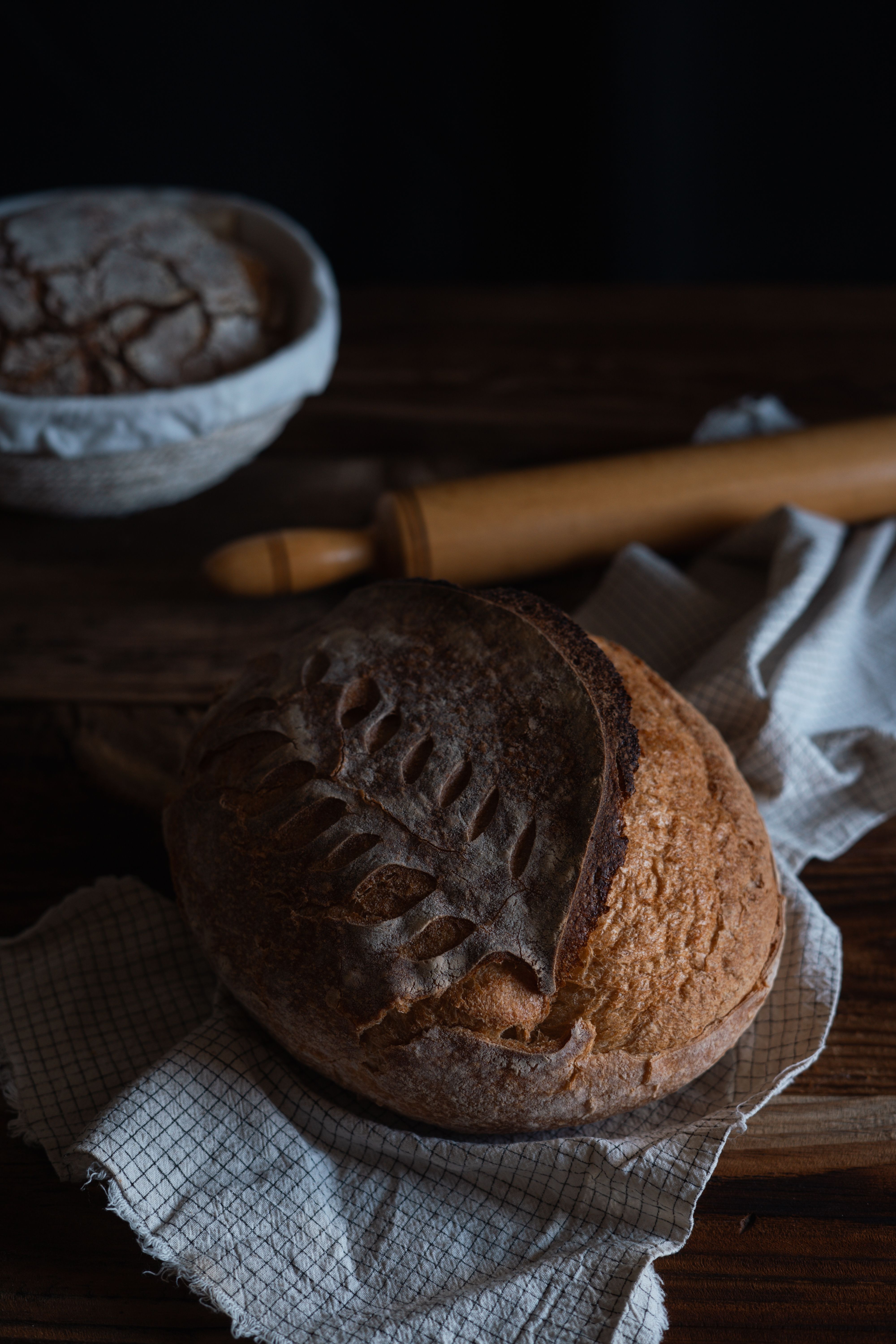 Rustic Artisan Bread on Wooden Table · Free Stock Photo