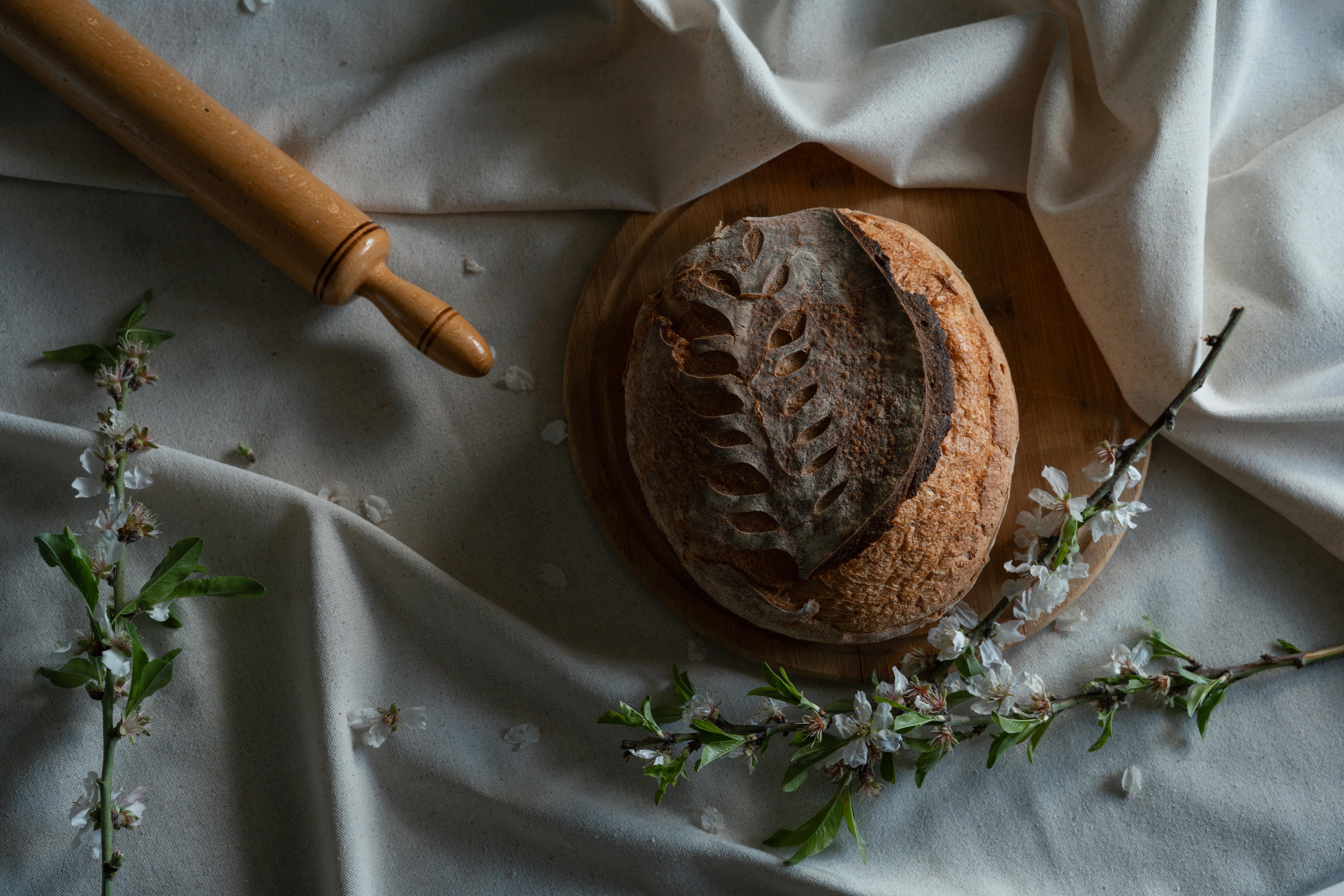 Artisan Sourdough Bread with Rustic Decor · Free Stock Photo